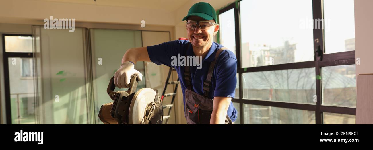 Carpenter working using electrical equipment for cutting board Stock ...