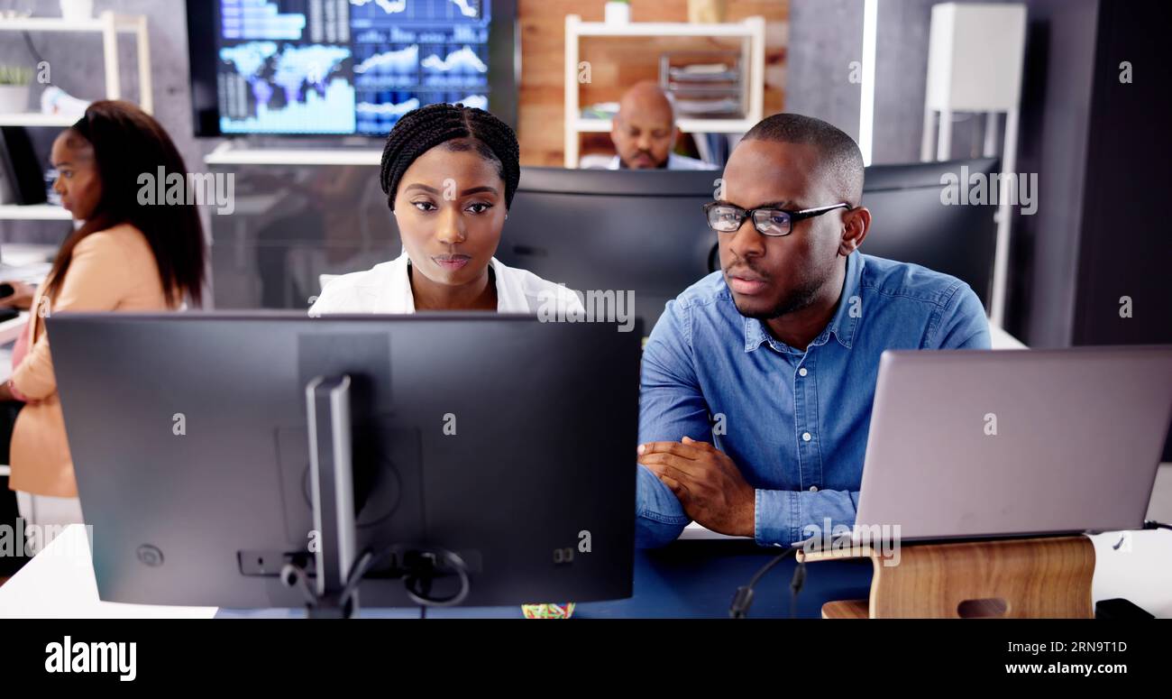 African Financial Data Analysts Using Performance Dashboard On Screens ...