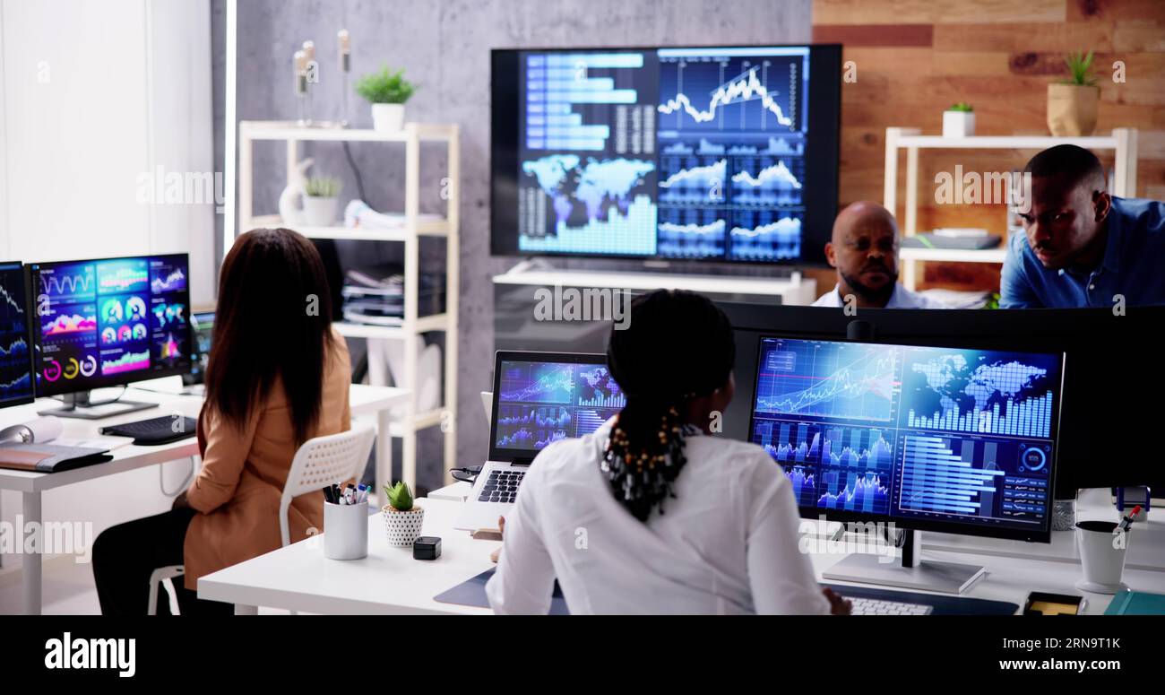 African Financial Data Analysts Using Performance Dashboard On Screens ...