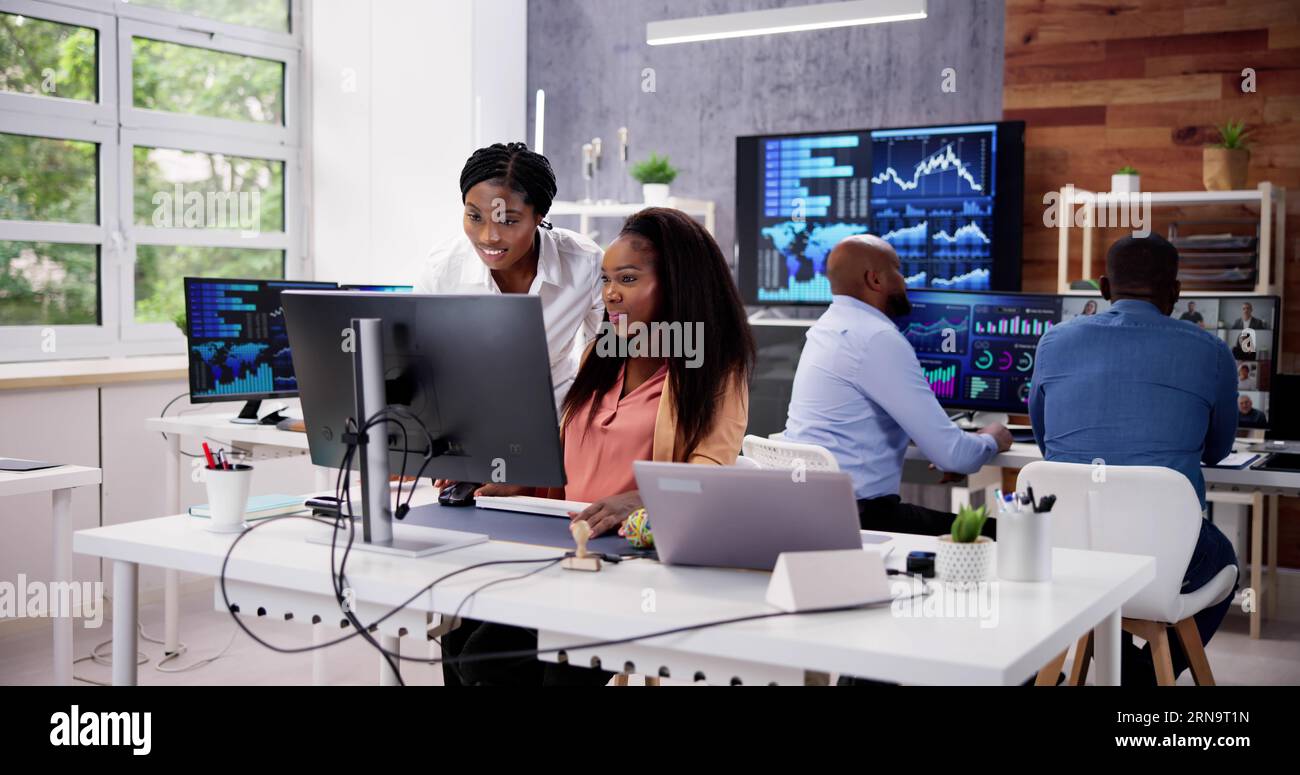 African Financial Data Analysts Using Performance Dashboard On Screens ...