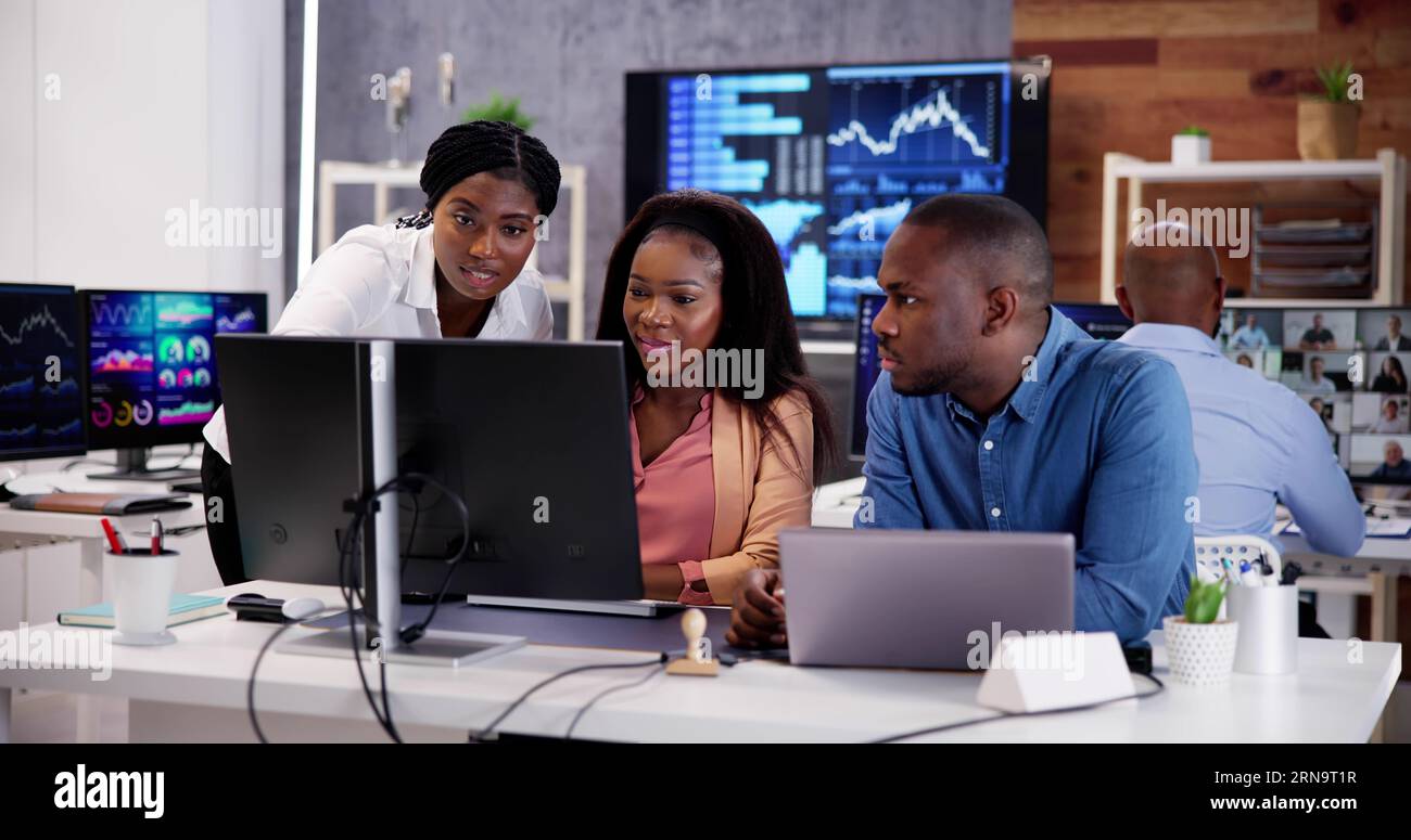 African Financial Data Analysts Using Performance Dashboard On Screens ...