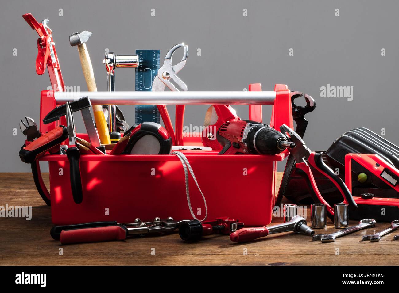 Toolbox With Various Work Tools On Wooden Desk Stock Photo - Alamy