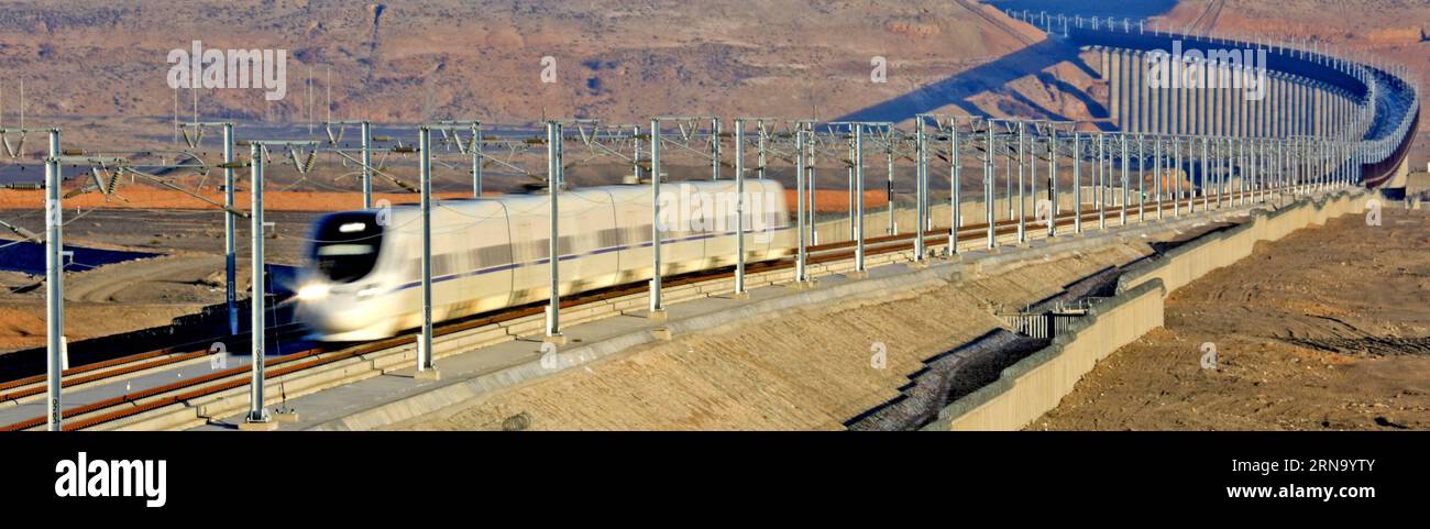 (151226) -- HAMI, Dec. 26, 2015 -- A high -speed train runs past the ...