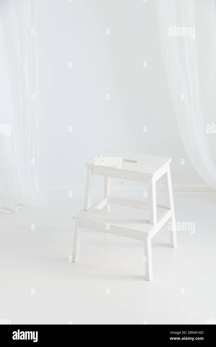 White empty chair with a white background Stock Photo - Alamy