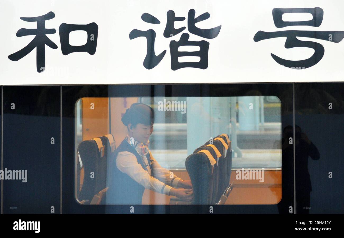 (151230) -- HAIKOU, Dec. 30, 2015 -- A steward arranges seats for ...