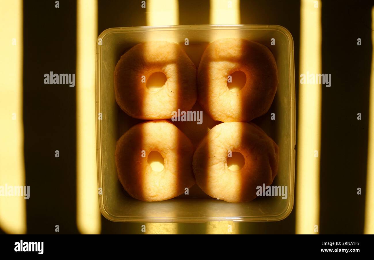 Plain doughnut on the box Stock Photo - Alamy