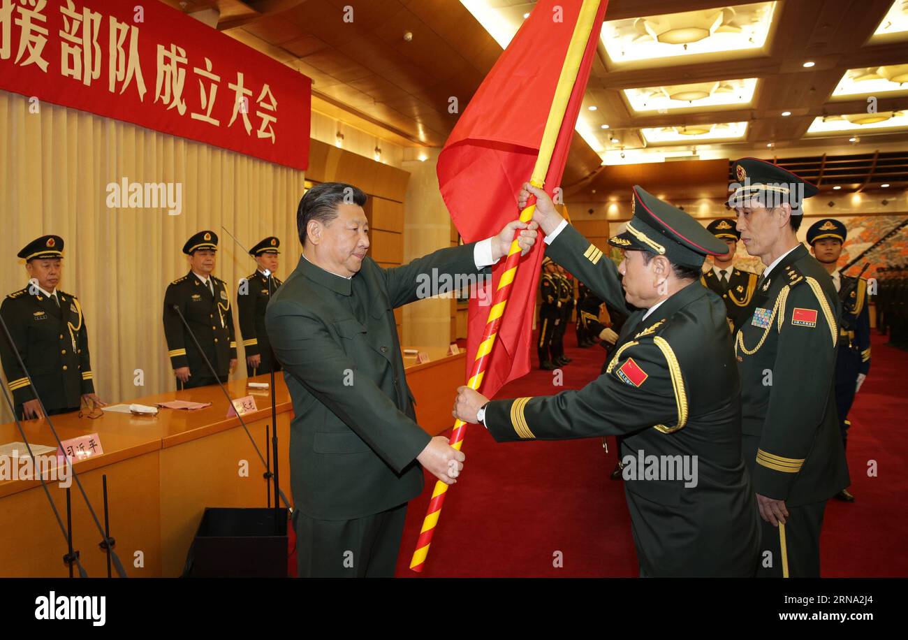Chinese President Xi Jinping (L F) confers the military flag to Wei ...