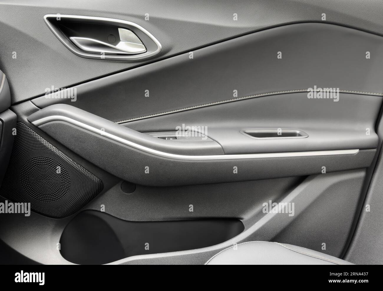 Door handle with Power window control buttons of a luxury passenger car ...