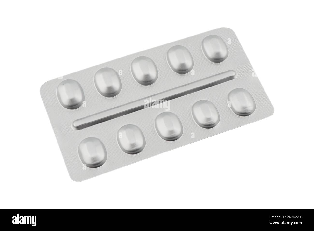 Macro shot pile of tablets pill in silver blister packaging isolated on ...