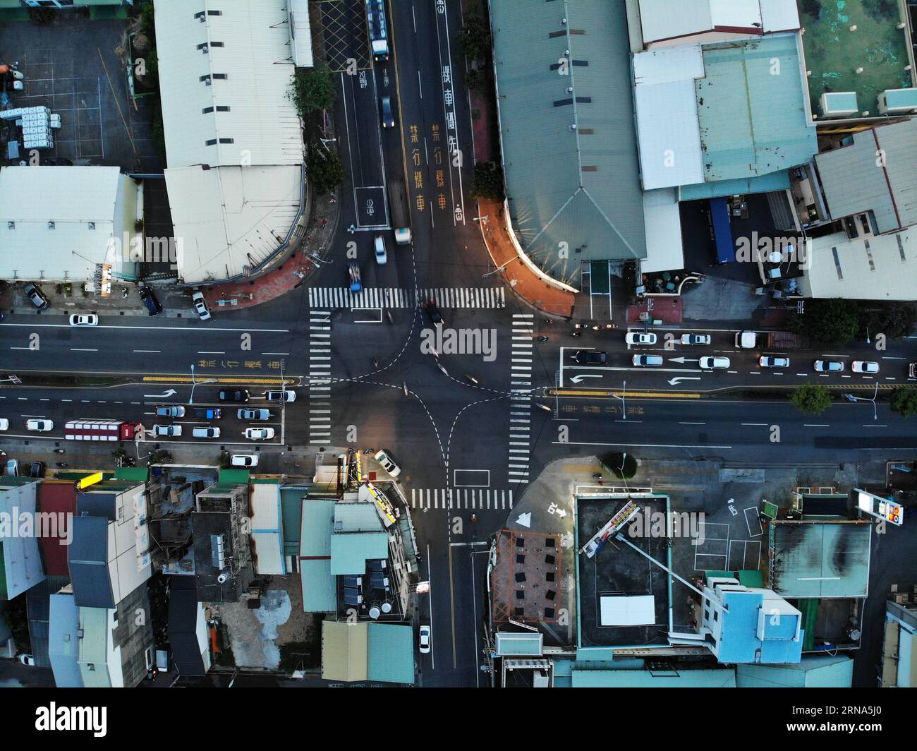 An aerial view of a bustling urban area with roads and buildings in ...