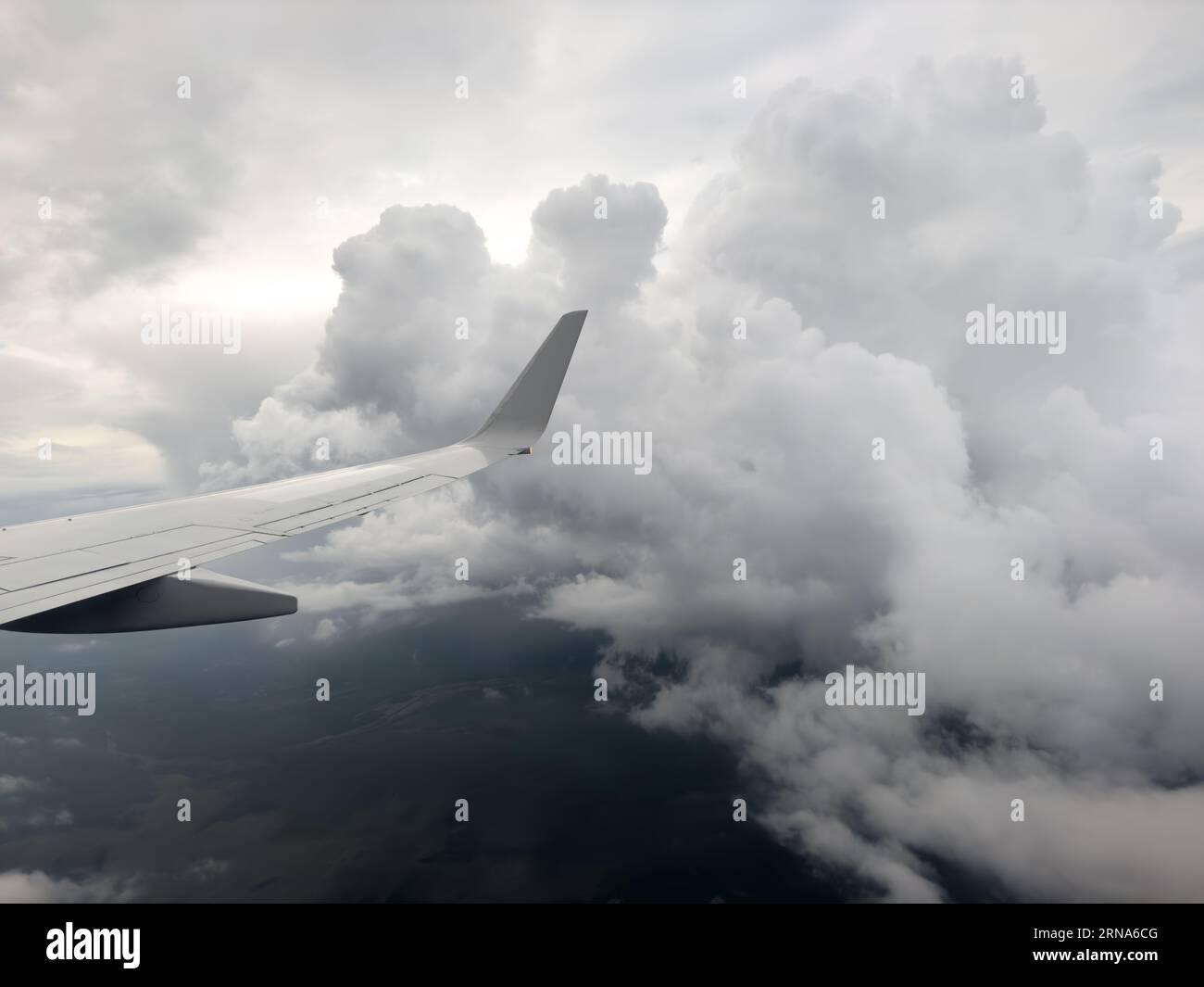 White wing from airplane window on stormy clouds. Great views of ...