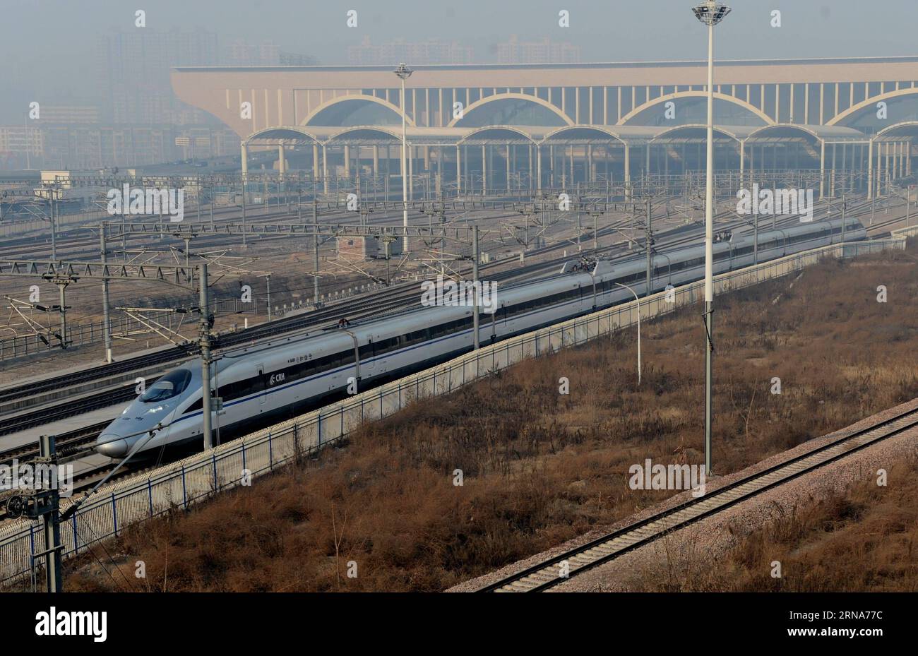 A bullet train sets off from Shijiazhuang Railway Station, north China ...