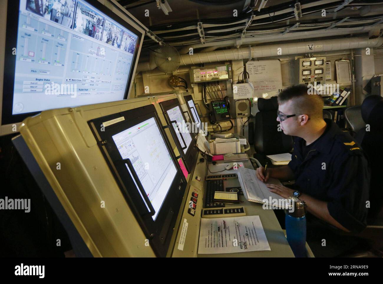VANCOUVER, -- A navy crew works inside the machinery control room ...