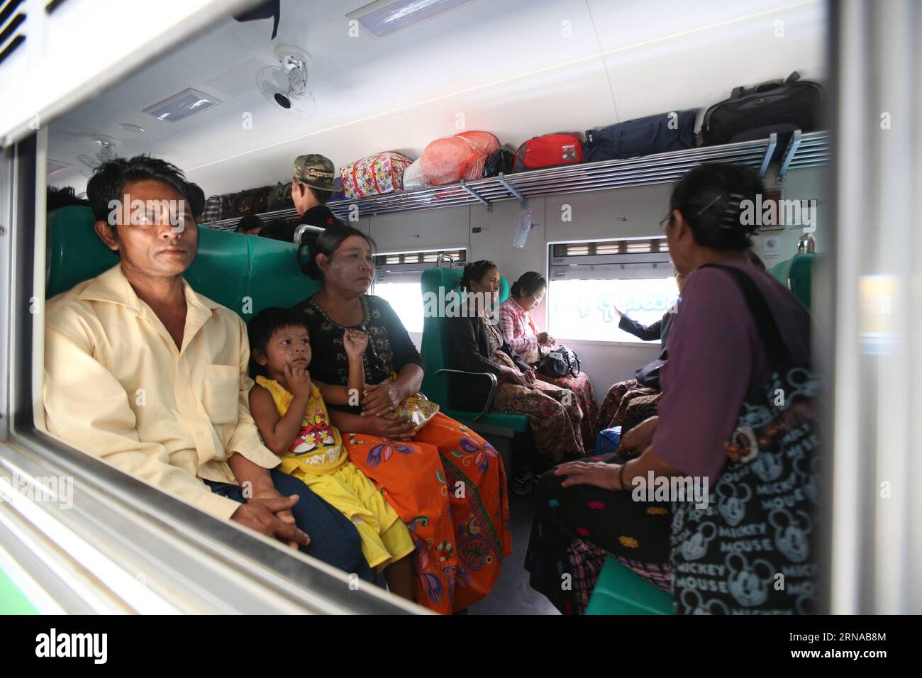 (160118) -- YANGON, Jan. 18, 2016 -- Passengers sit on a new express ...