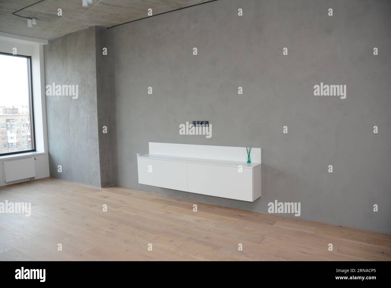 Emty room with loft design, wooden floor and console table, tv table ...