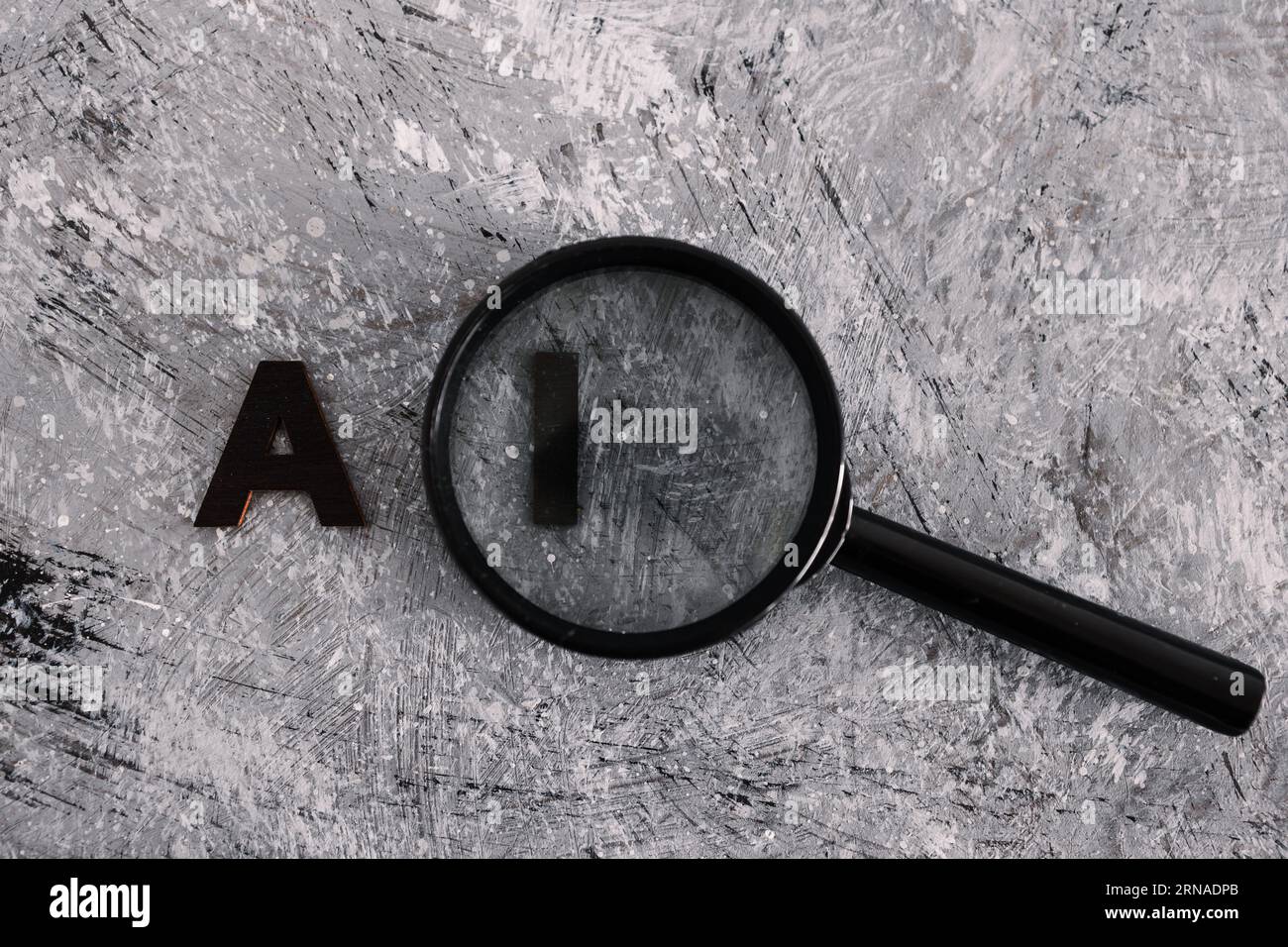 AI text with magnifying glass analysing the I for intelligence, concept ...