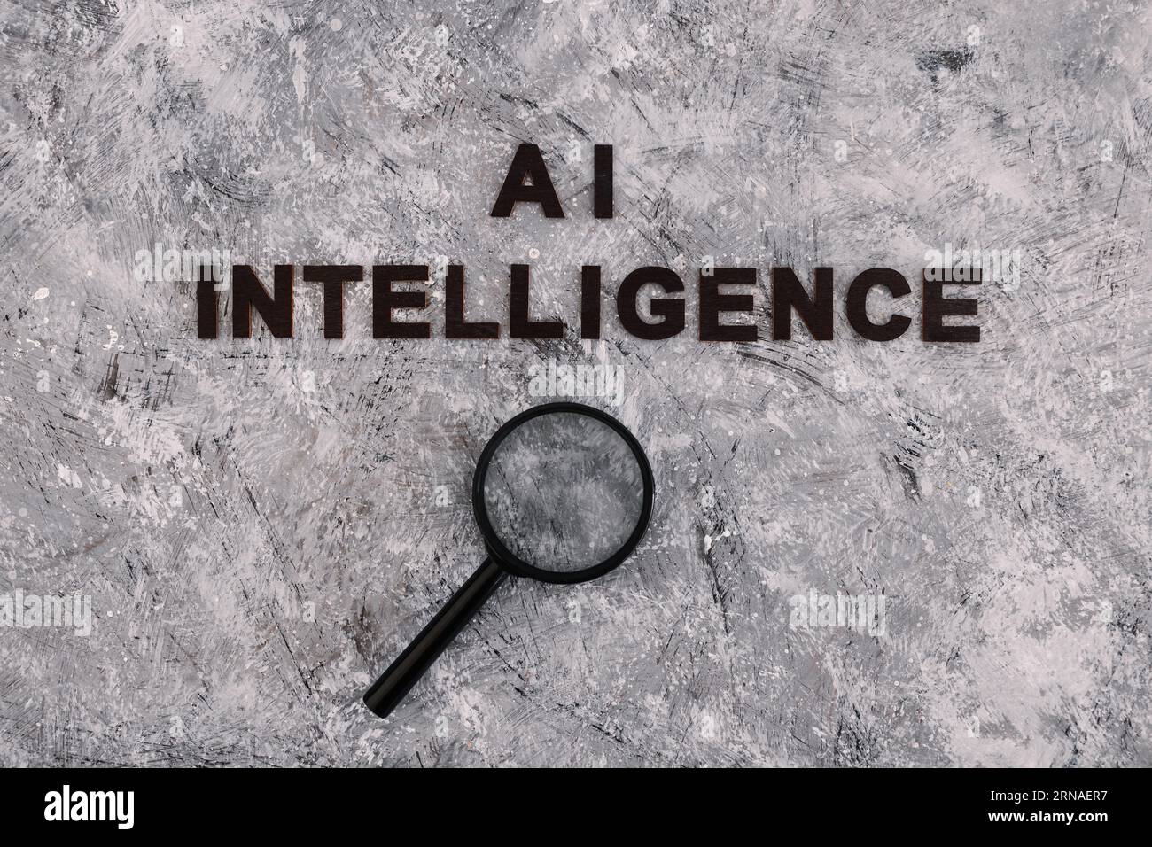 AI intelligence text with magnifying glass analysing it, concept of ...