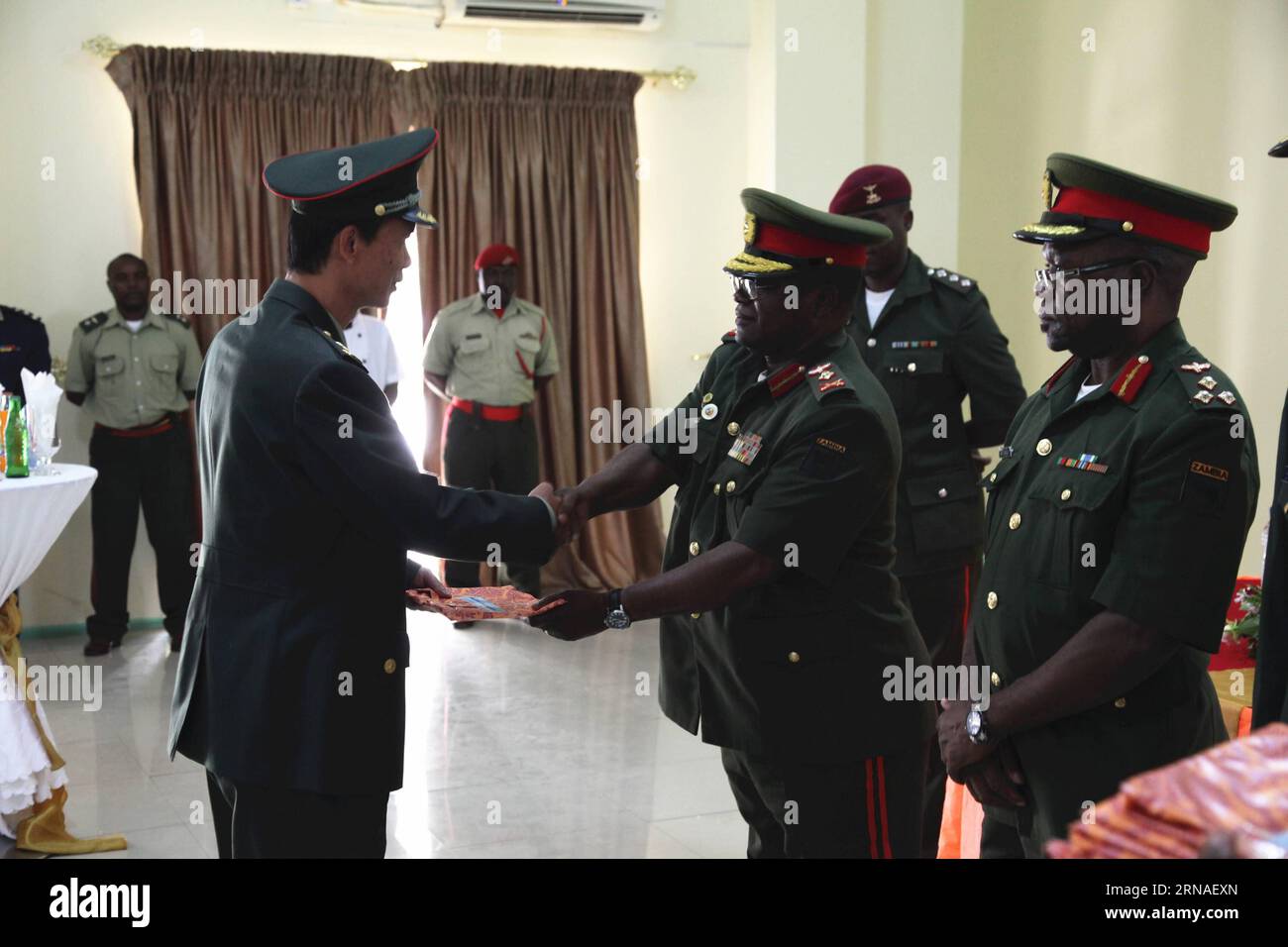 A member of the 18th Chinese military medical team receives the Zambia ...