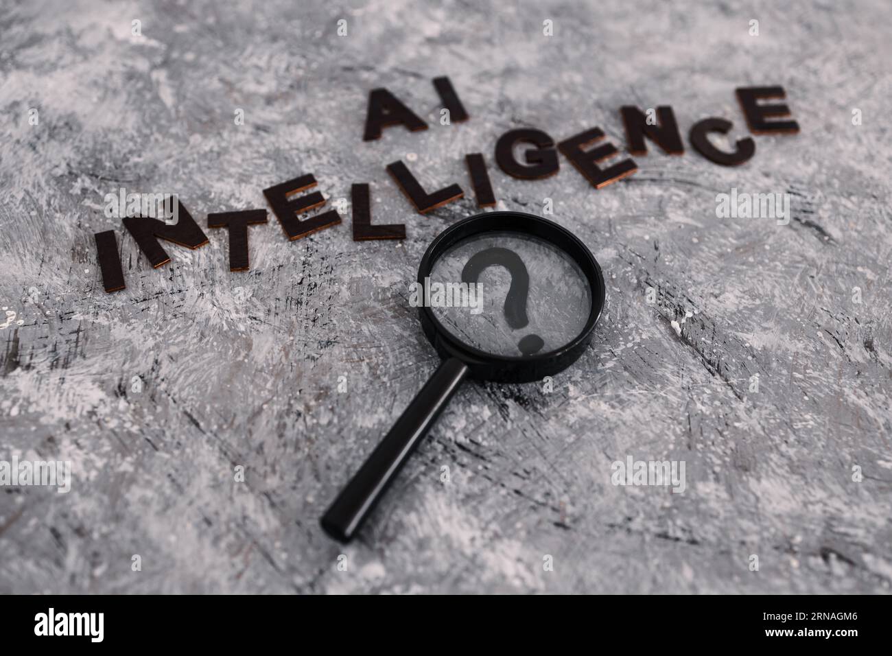 AI intelligence text with magnifying glass analysing a question mark ...