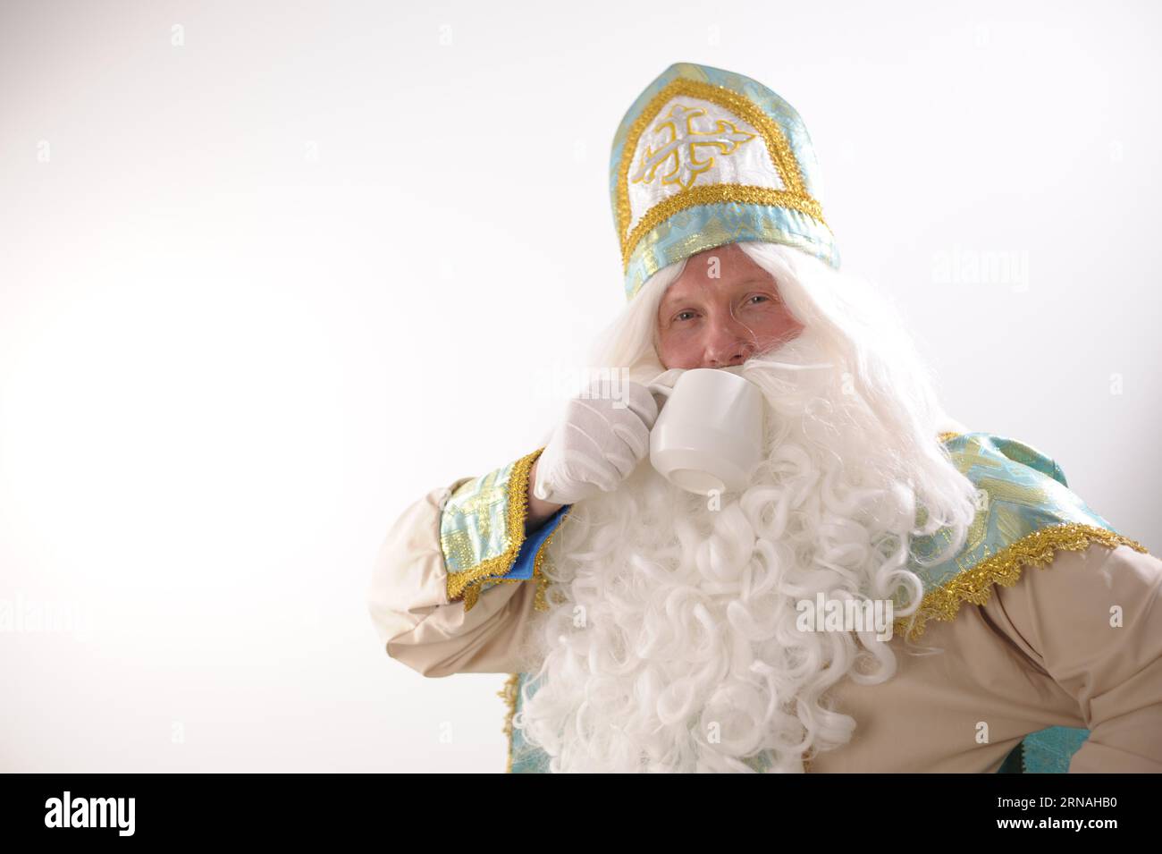 place for text on a white background a man in costume of St. Nicholas ...