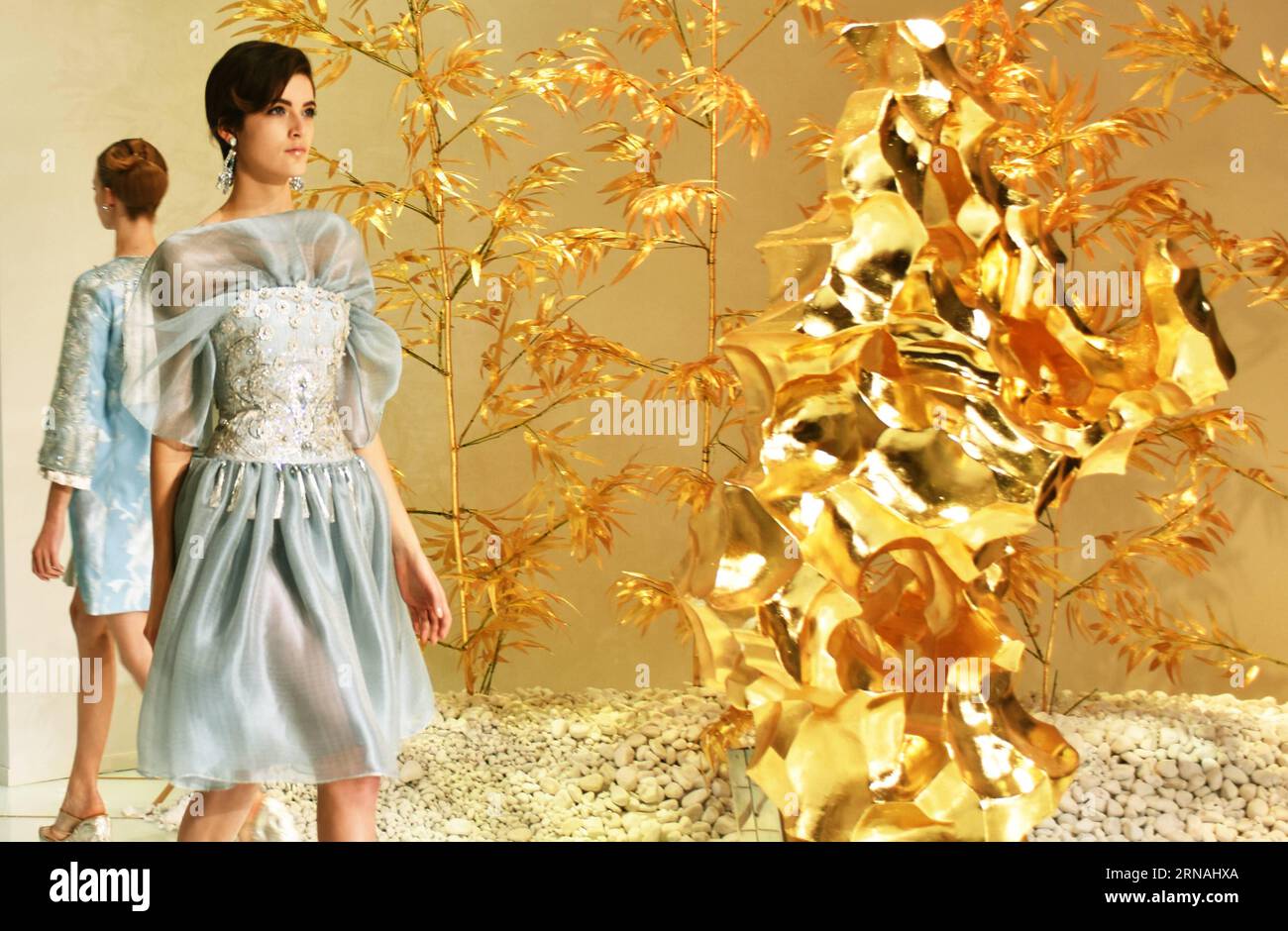 Models present creations by Chinese designer Guo Pei during the 2016 ...