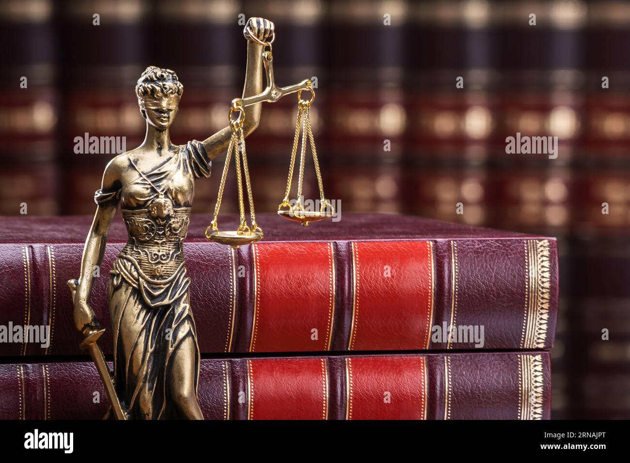 Golden Lady Justice Near Wooden Gavel Over Law Book Stock Photo - Alamy