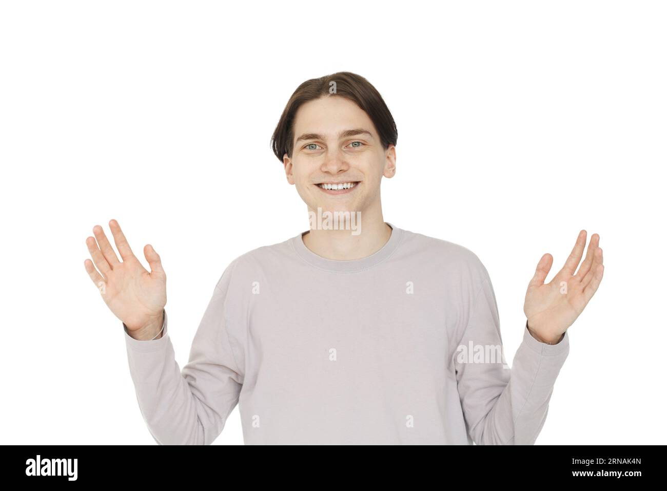 Happy surprised man with hands up on white background Stock Photo - Alamy