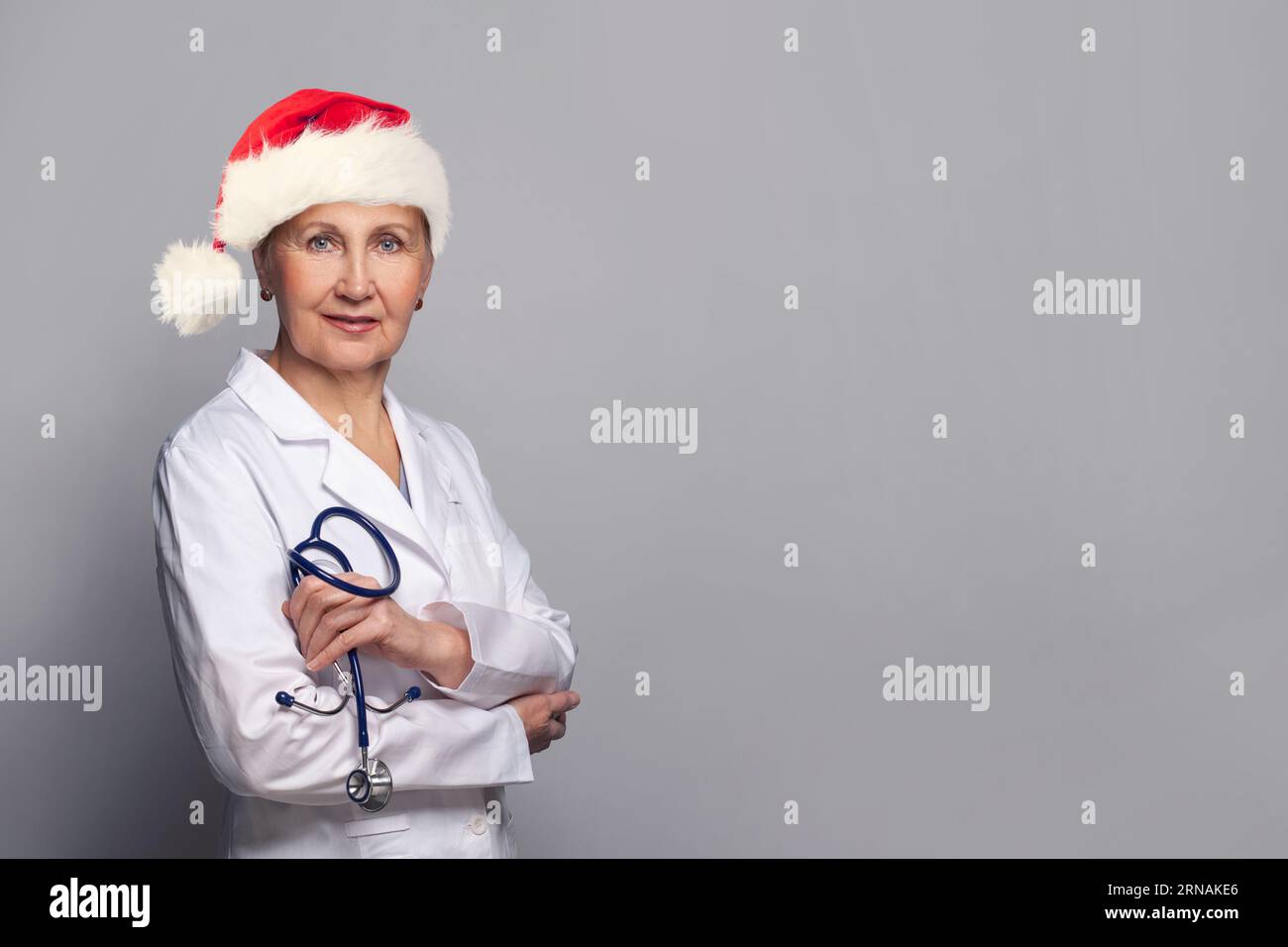 Mature female doctor santa hi-res stock photography and images - Alamy