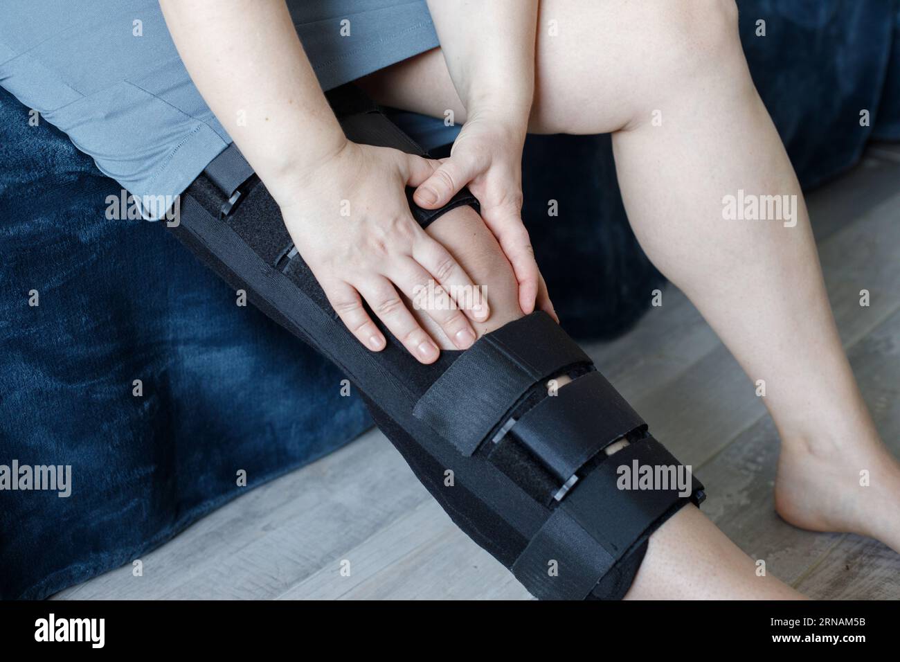 Wman patient with bandage compression knee brace support injury on the ...