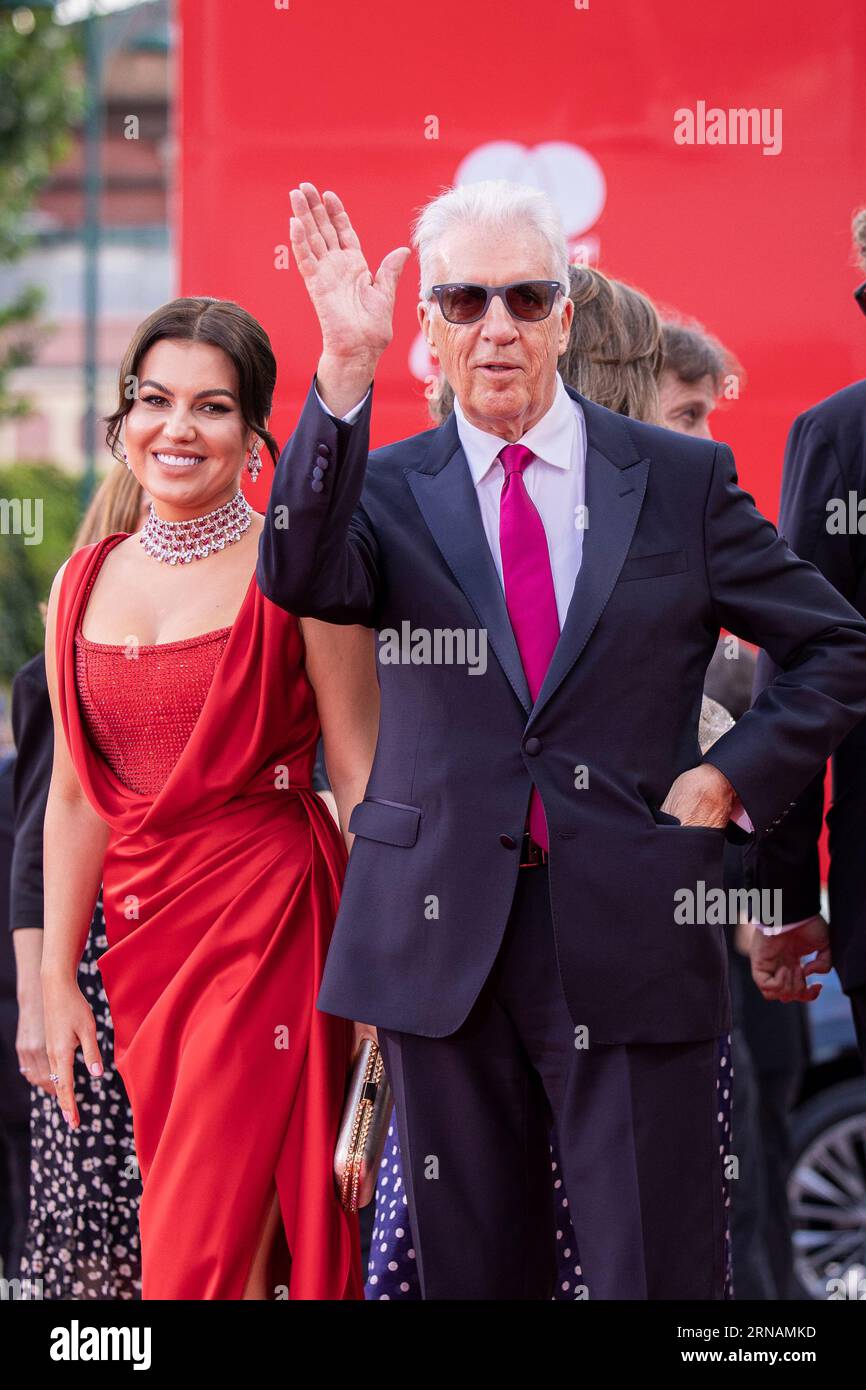 Romina Gingasu, left, and Piero Ferrari pose for photographers upon ...