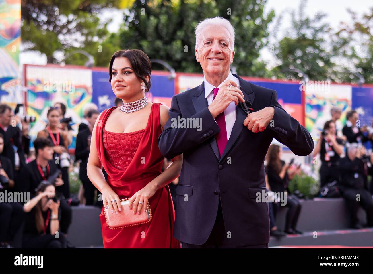 Romina Gingasu, left, and Piero Ferrari pose for photographers upon ...