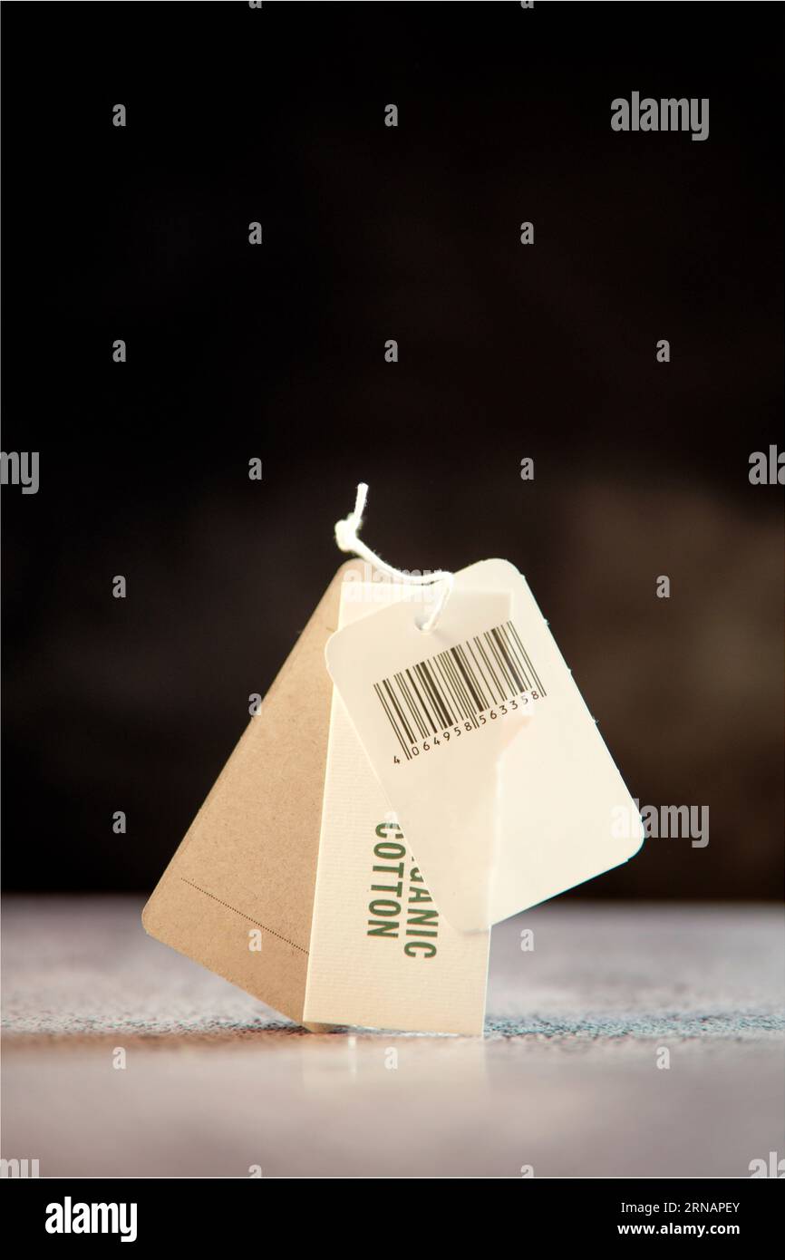organic cotton clothing labels on a dark background Stock Photo - Alamy