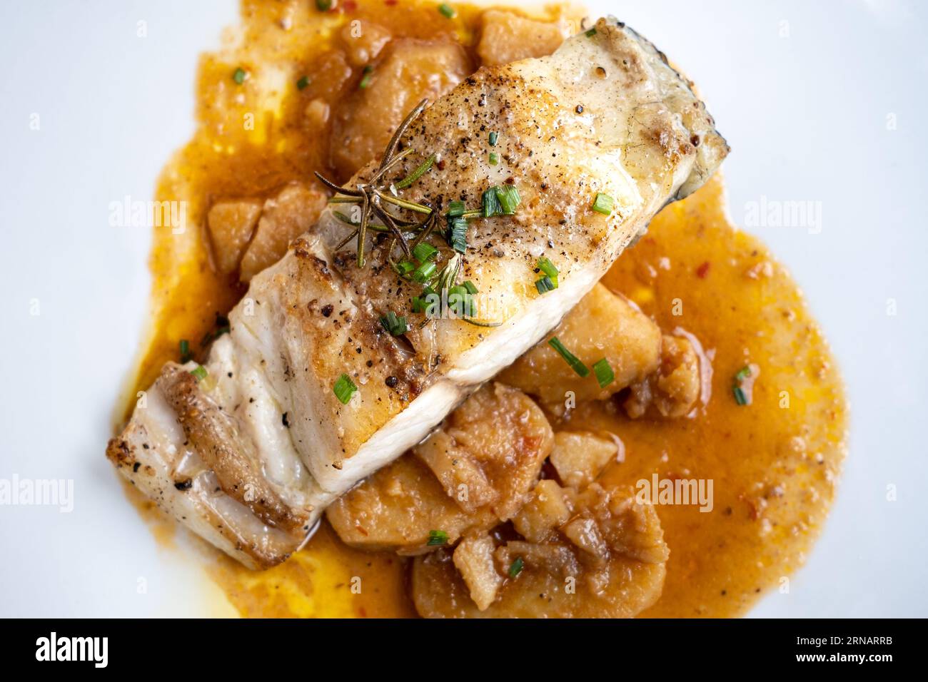 top close up take of a croaker fish dish cooked in the oven with ...