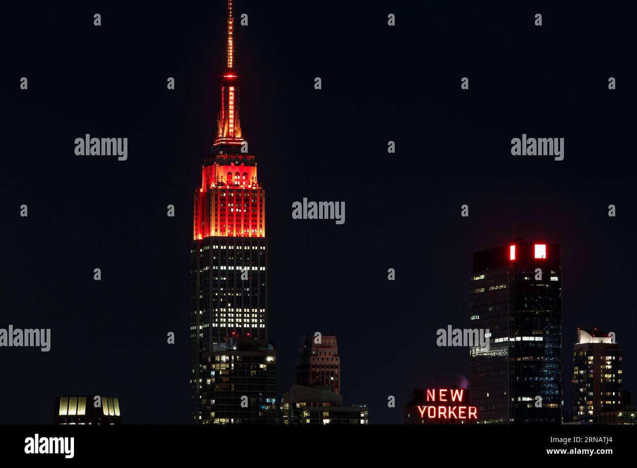 The iconic Empire State Building is lit up in red and gold in honor of ...