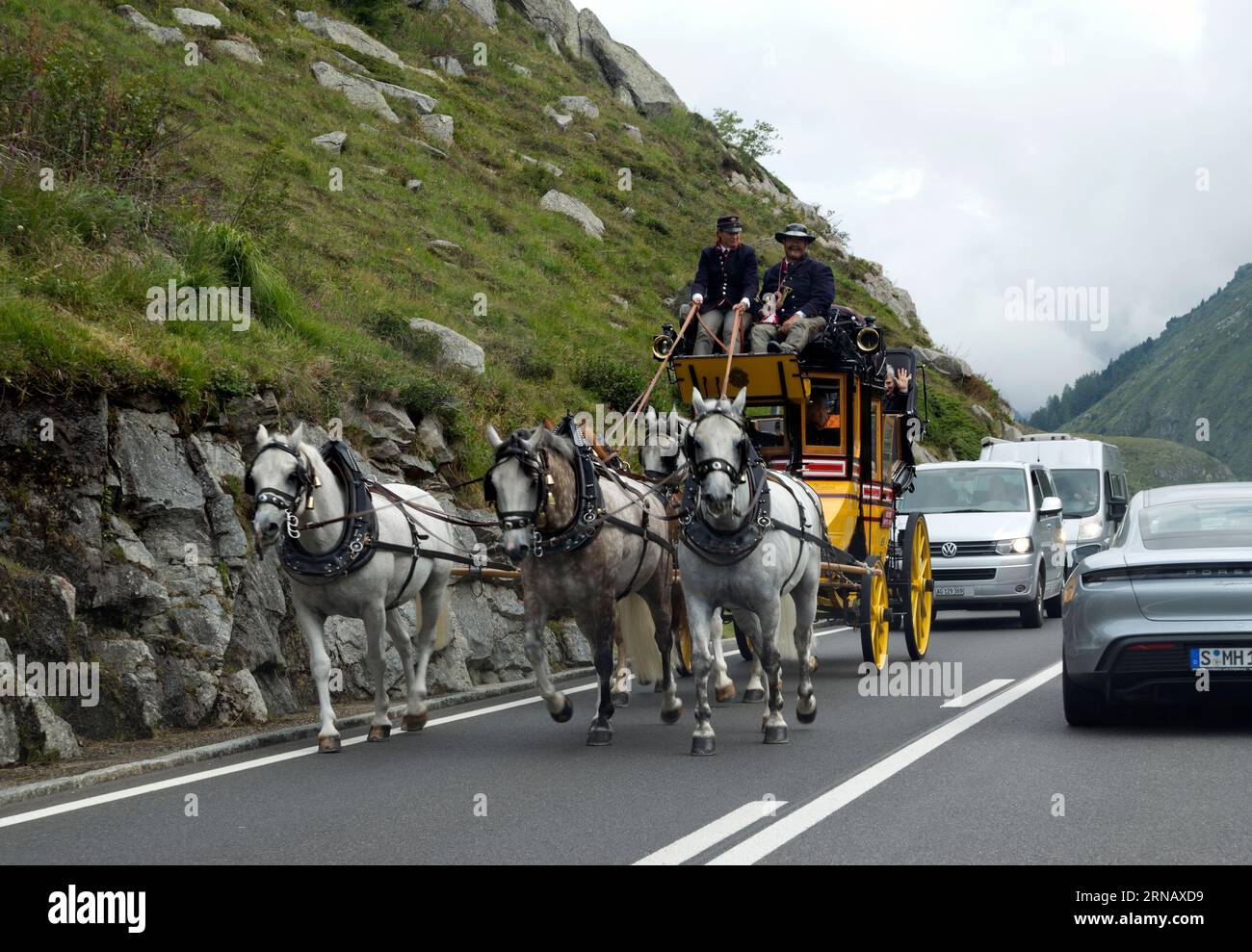 St. GOTTHARD PASS, SWITZERLAND - AUGUST 4, 2023: people driving a ...
