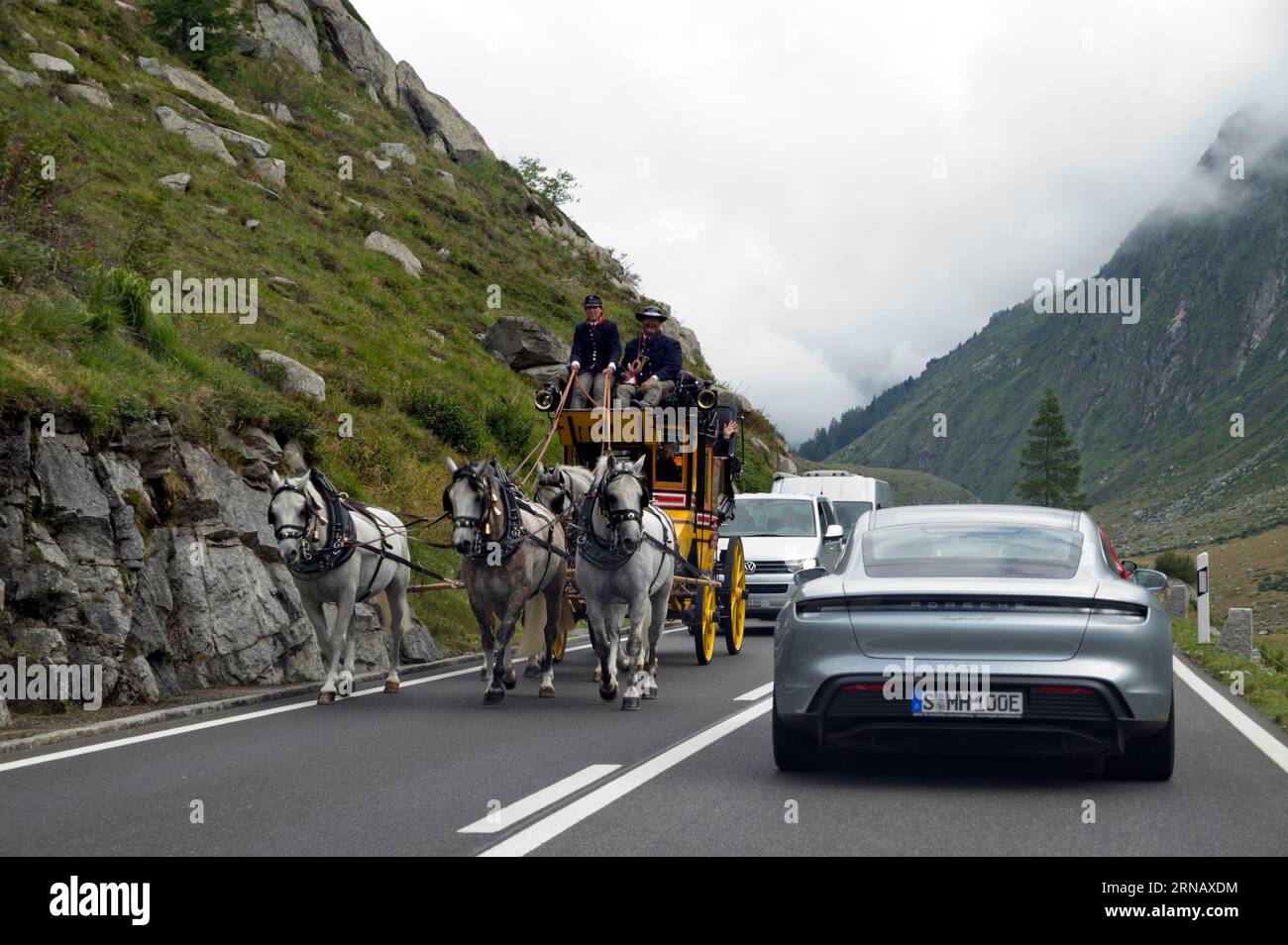 St. GOTTHARD PASS, SWITZERLAND - AUGUST 4, 2023: people driving a ...