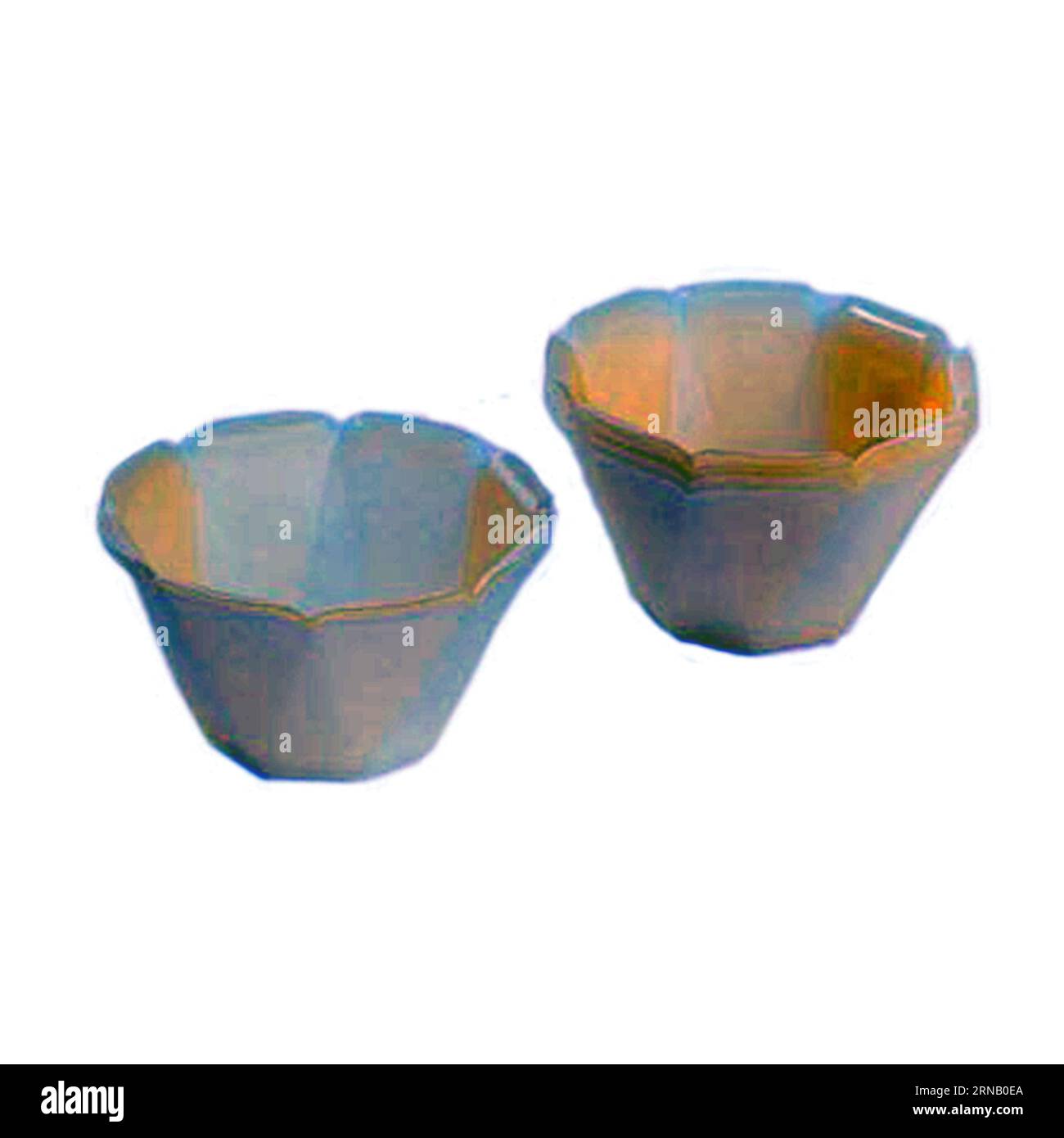 Two yellow plastic cups isolated over white background, confectionery ...