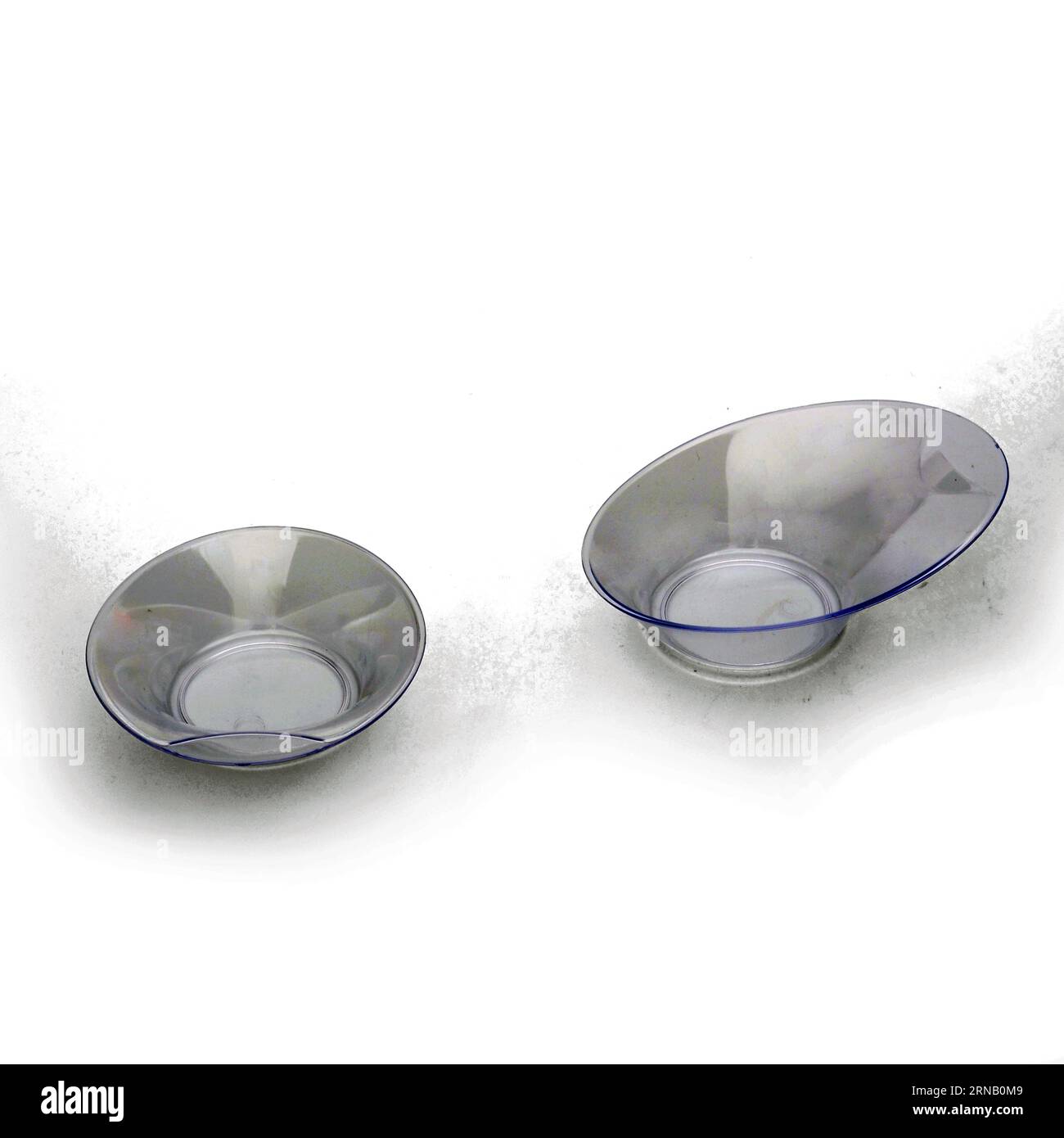 Two transparent plastic cups isolated over white background ...