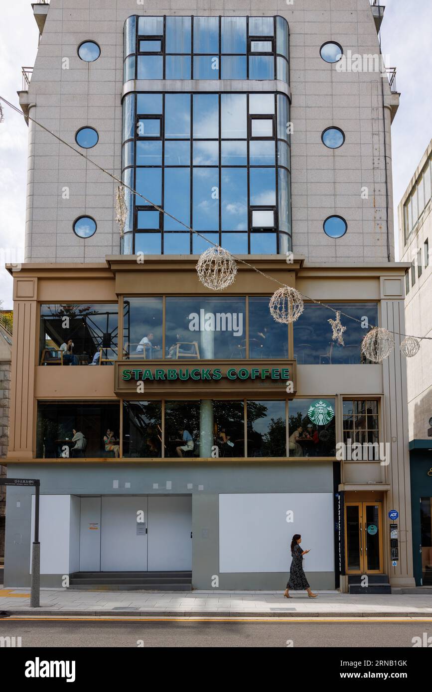 A modern Starbucks building located in the vibrant city of Seoul, South ...
