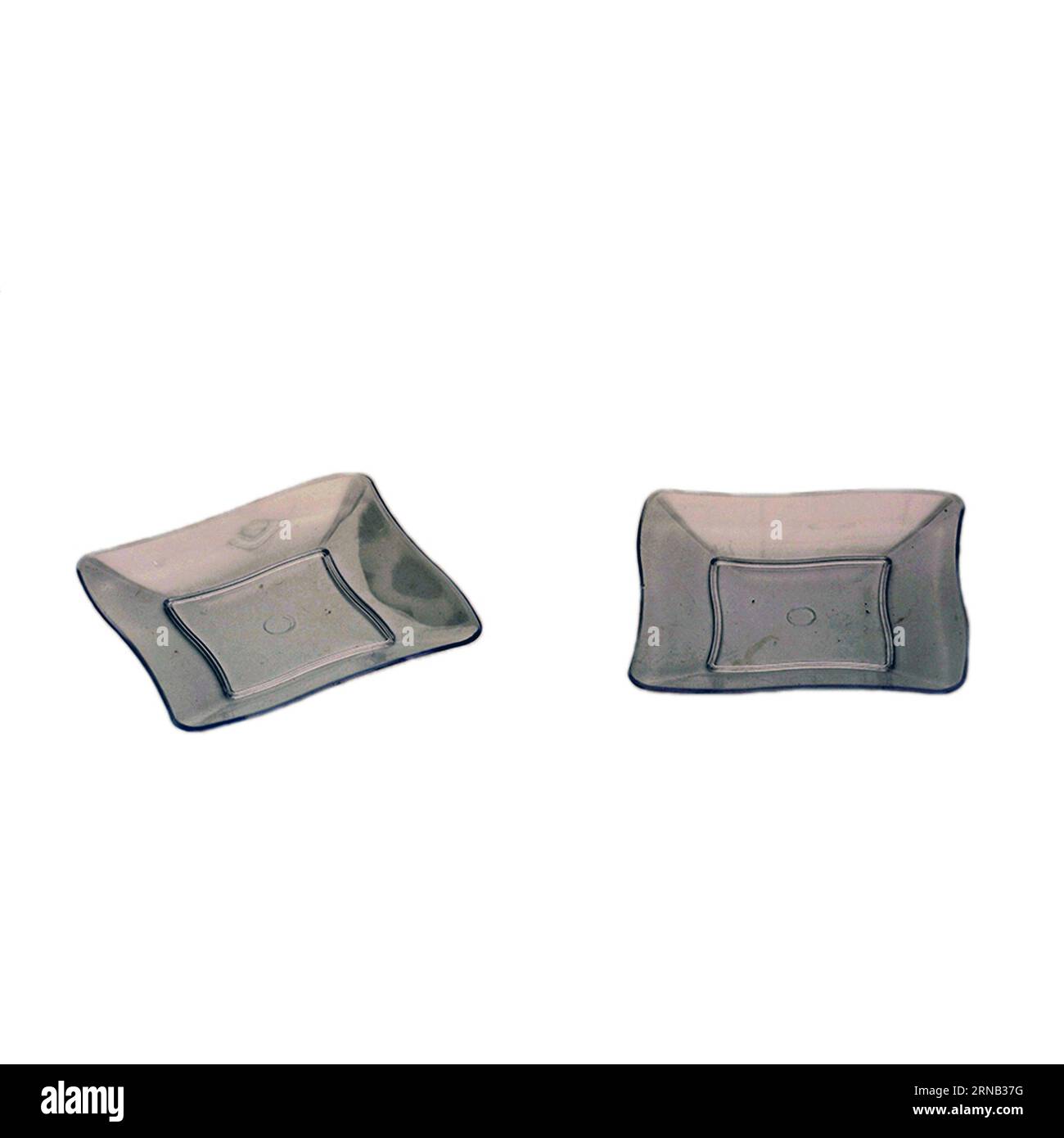 Two transparent plastic dessert plates isolated over white background ...