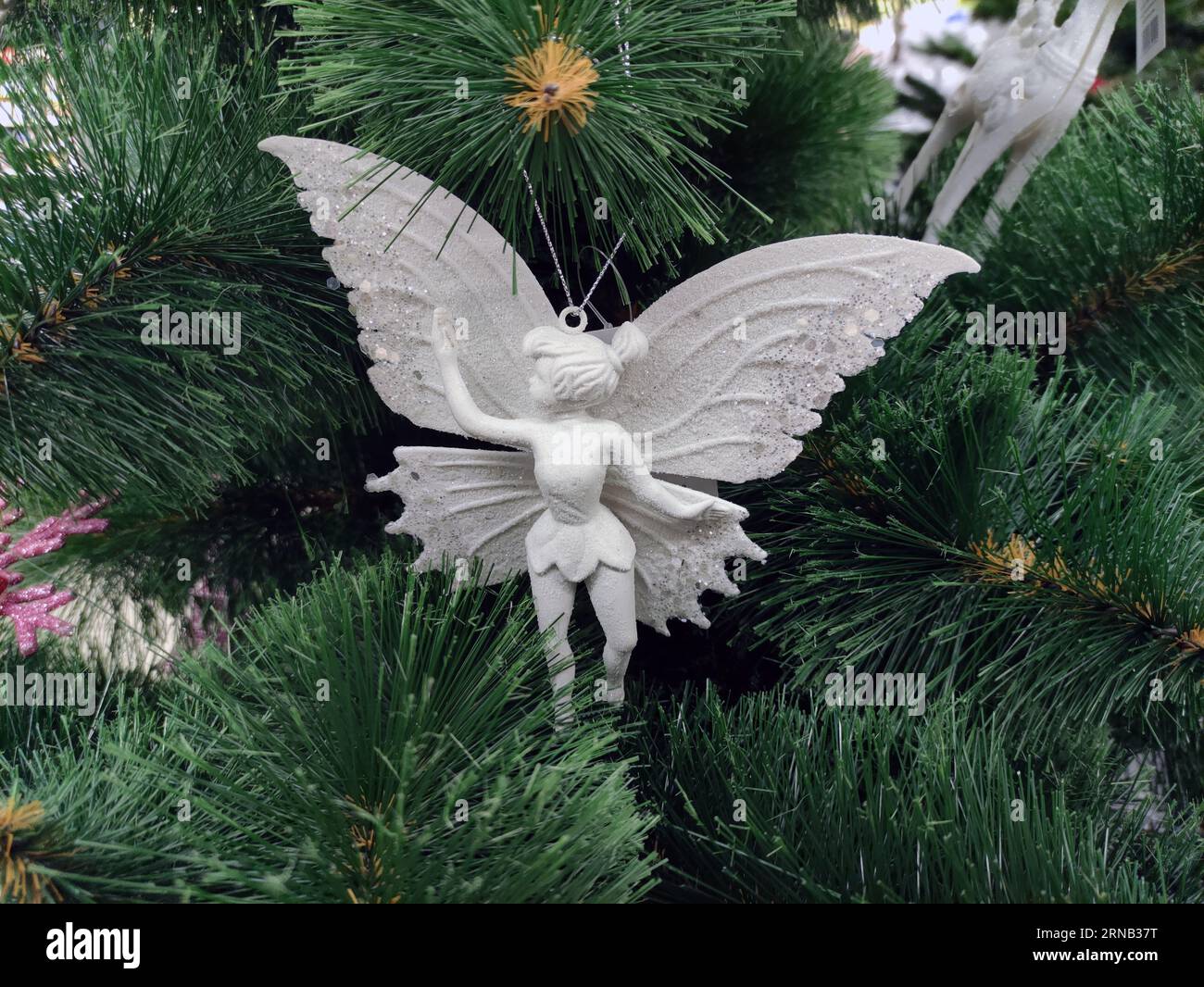 Fur tree branches with Christmas angels and fairies, New Year tree ...