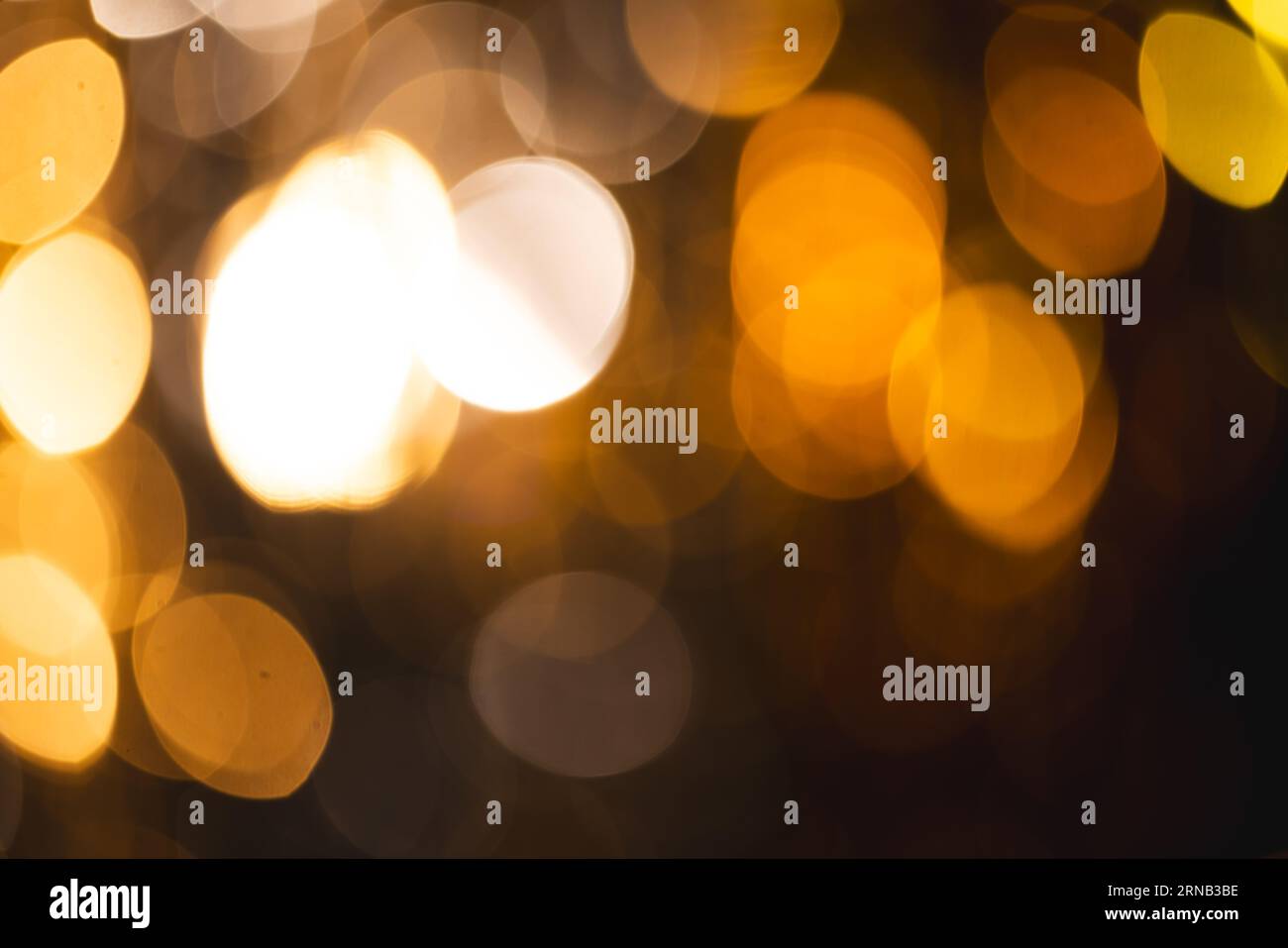 Yellow bokeh lights with copy space on dark background Stock Photo - Alamy