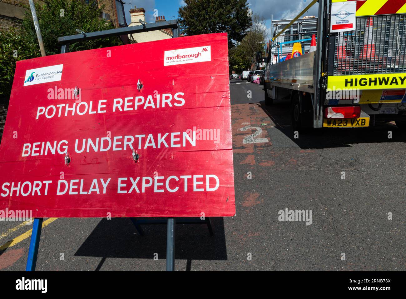 Pothole repairs being undertaken. Short delay expected. Road sign ...