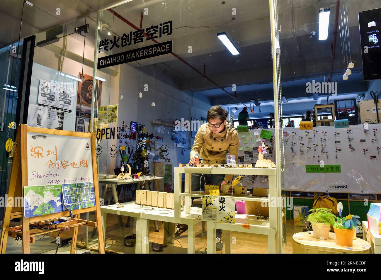 A man looks at products at Chaihuo Makerspace in Nanshan District of ...