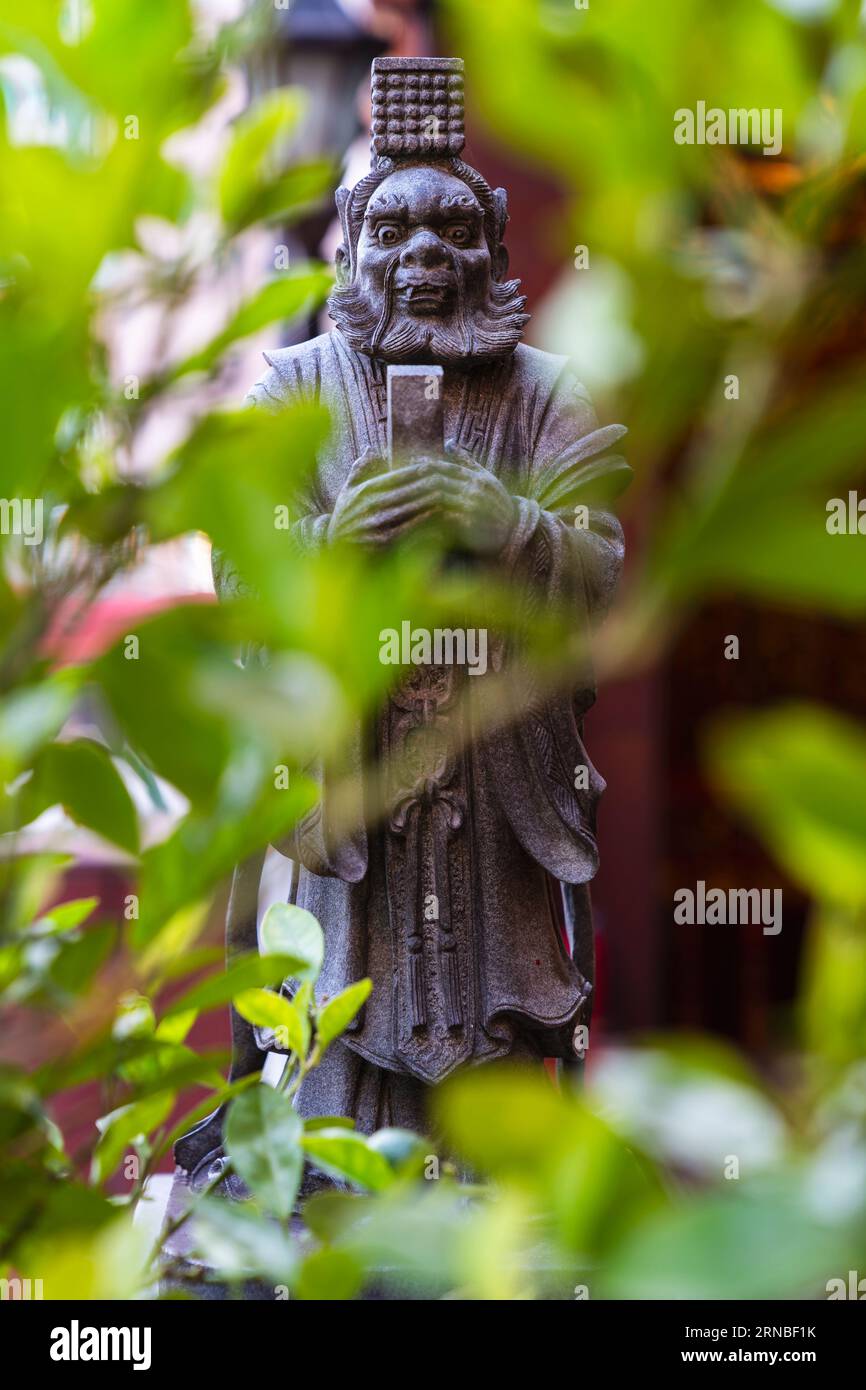 Statue in temple Stock Photo - Alamy