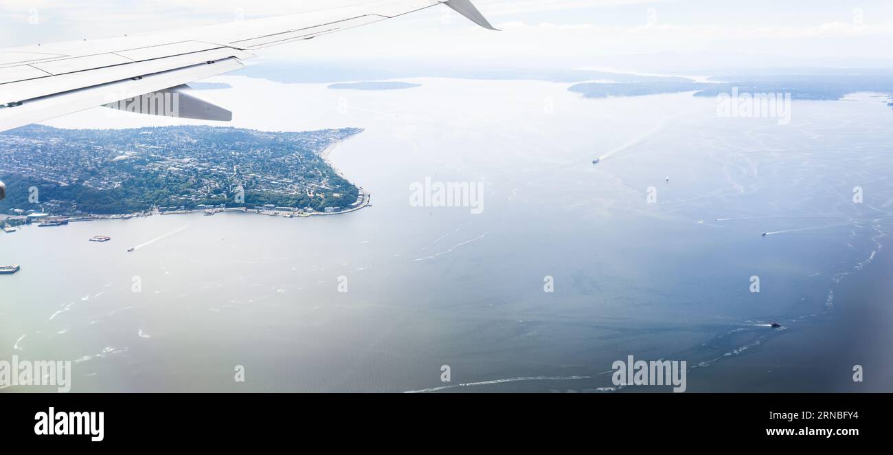 Aerial view of an airplane wing flying towards Seattle. Washington ...