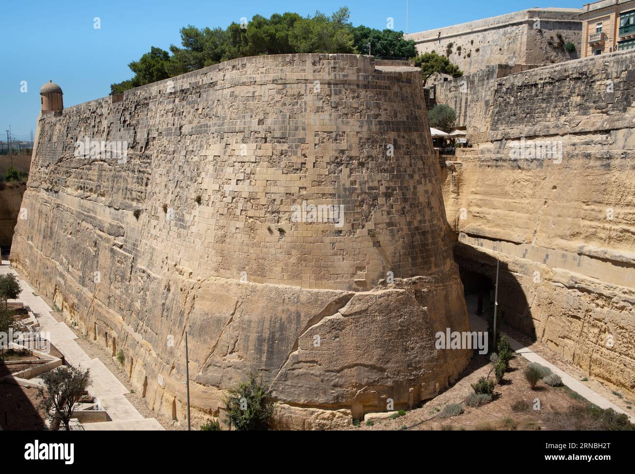Part of the historic fortifications in Malta. Thick stone walls protect ...