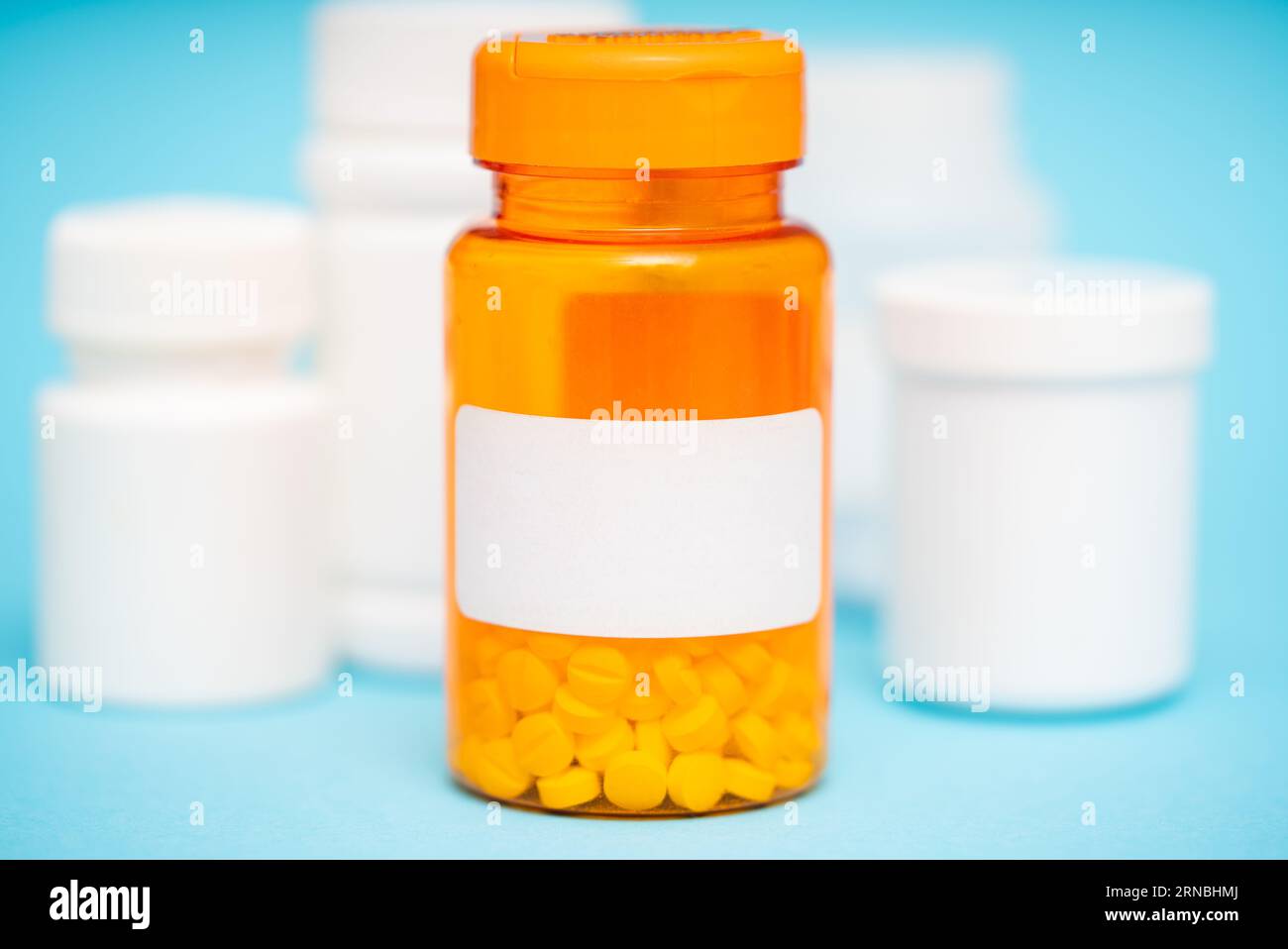 Amber prescription packaging for pills on a blue background with a ...