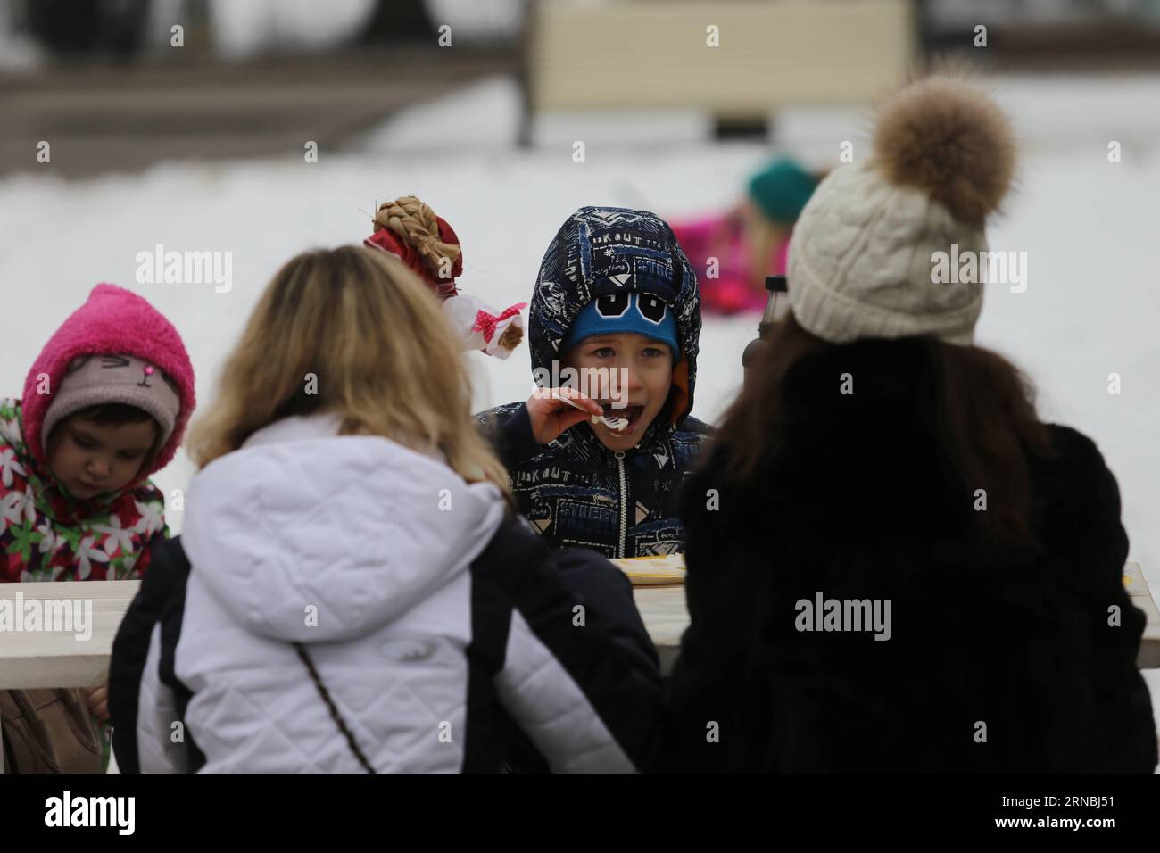 (160307)-- MOSCOW, March 7, 2016-- A child eats bliny, a traditional ...