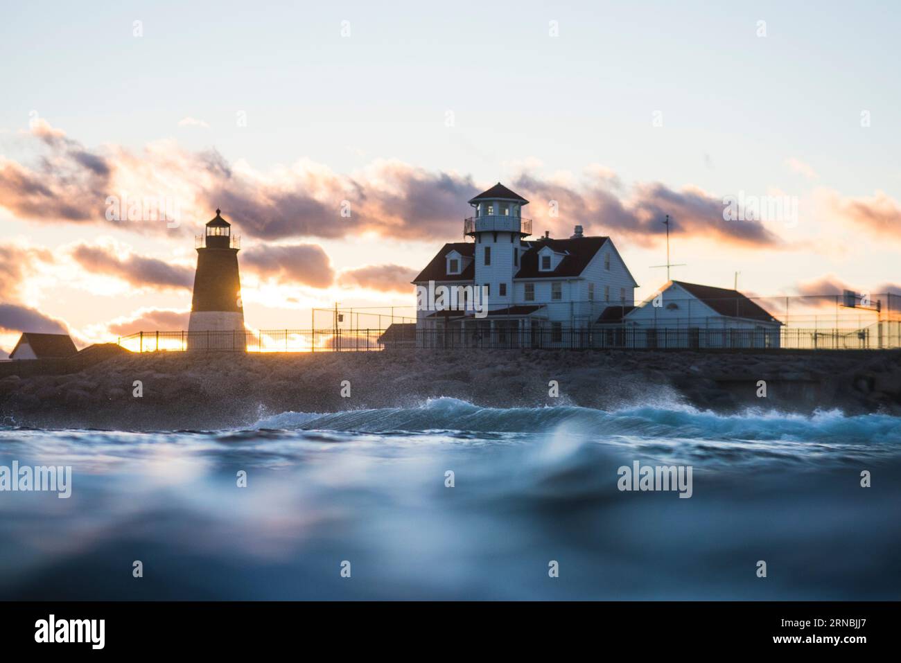 Point Judith Lighthouse at Sunset as seen from the Ocean Stock Photo ...